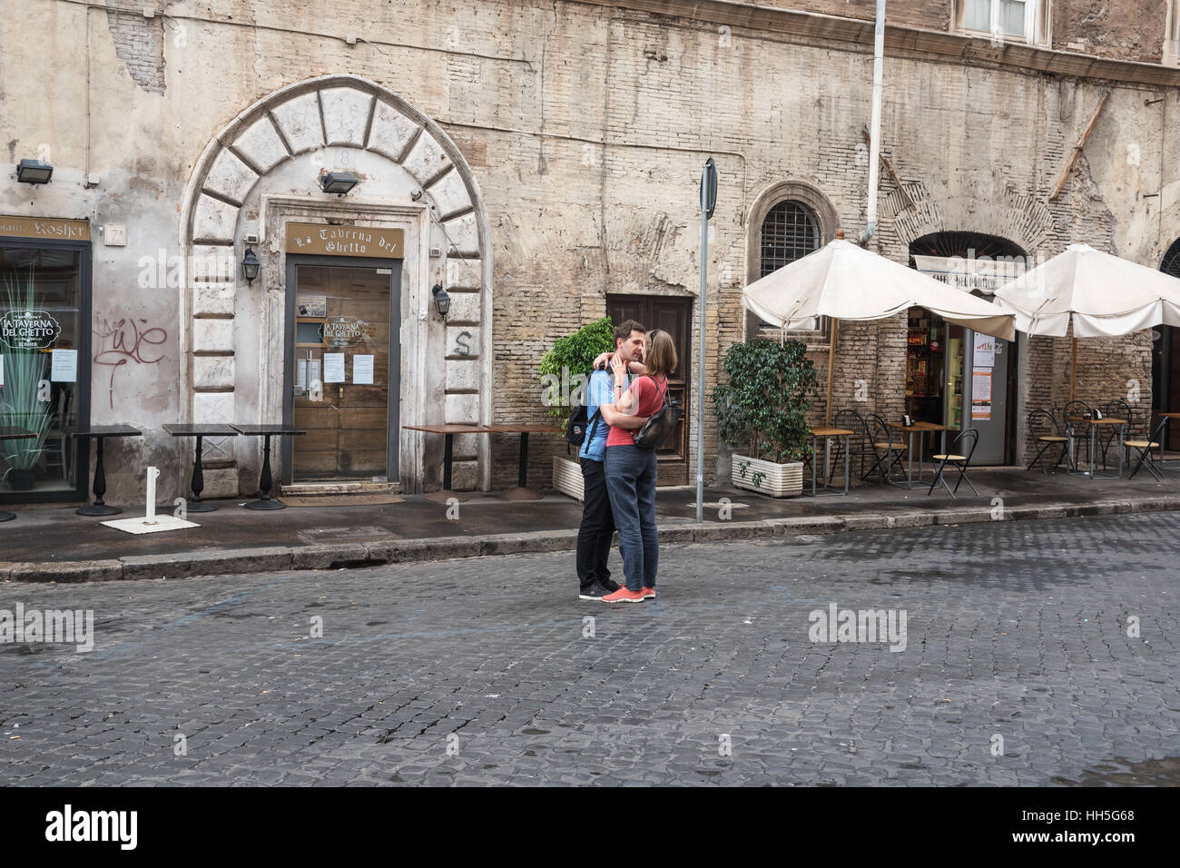 Roman kiss, young couple kissing on the street, Rome, Italy, Europe ...