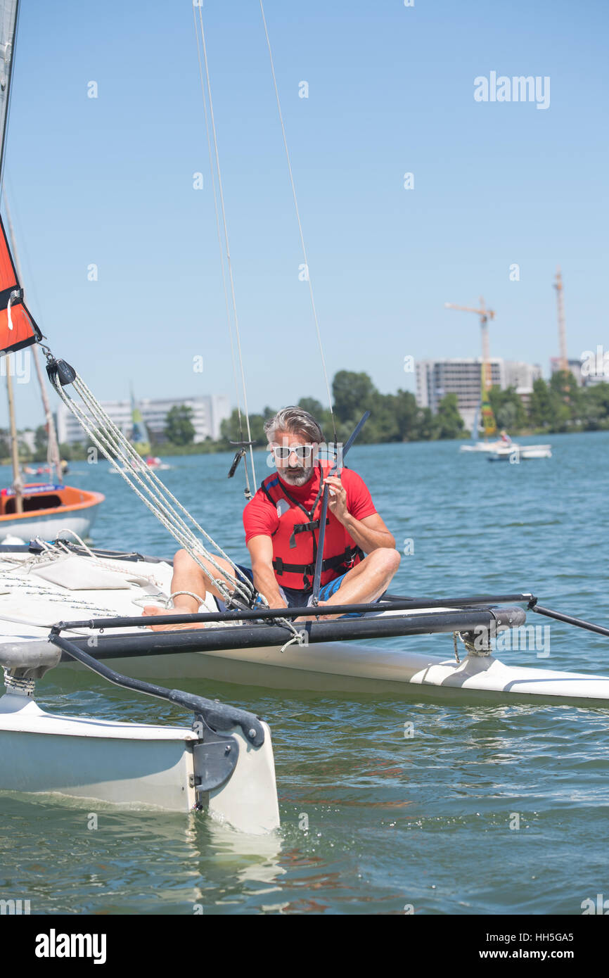 professional waterman training on lake with catamaran Stock Photo - Alamy