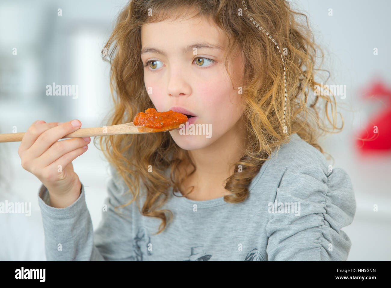 Little girl cooking spaghetti Stock Photo - Alamy