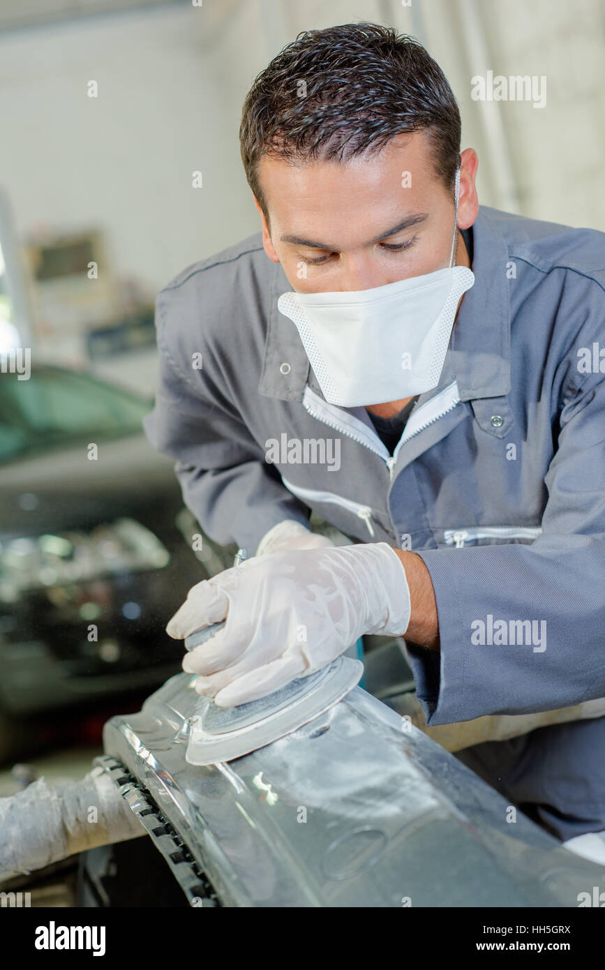 polishing an automobile part Stock Photo - Alamy