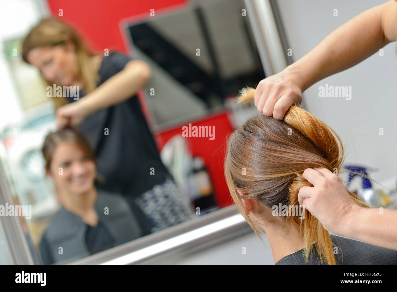 Getting her hair done Stock Photo - Alamy