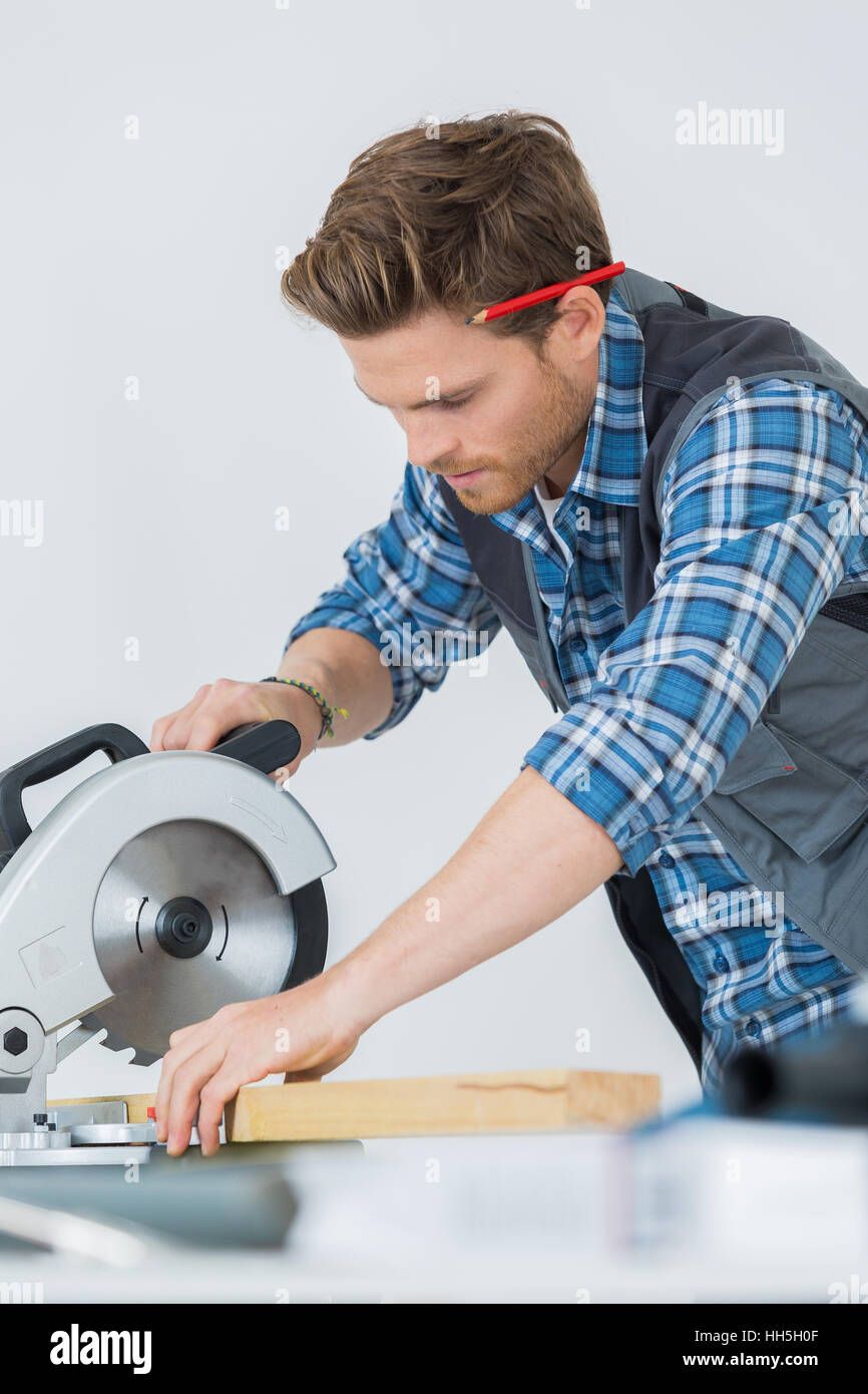 using a drop saw Stock Photo - Alamy