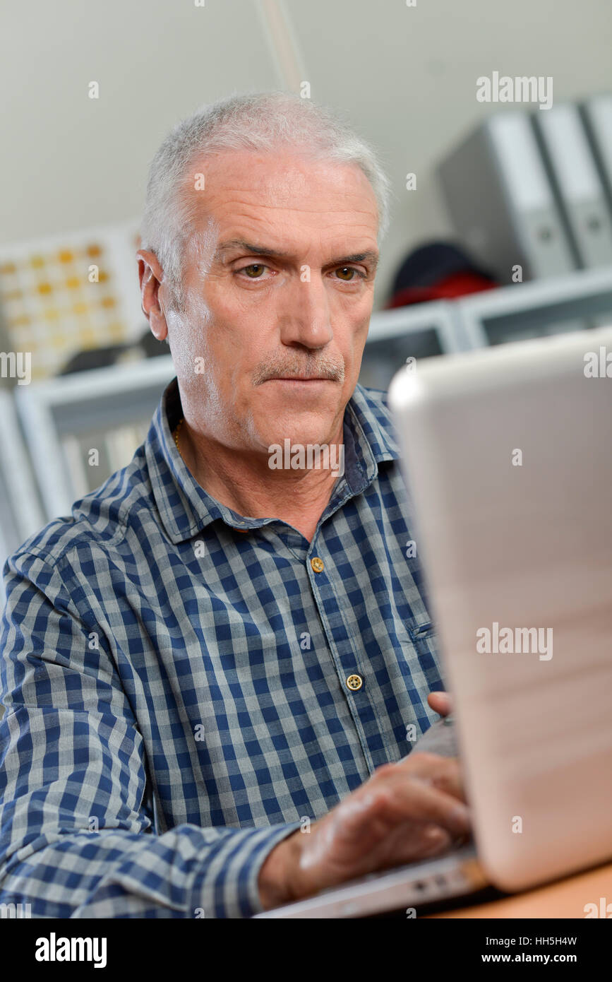 Senior office worker Stock Photo - Alamy