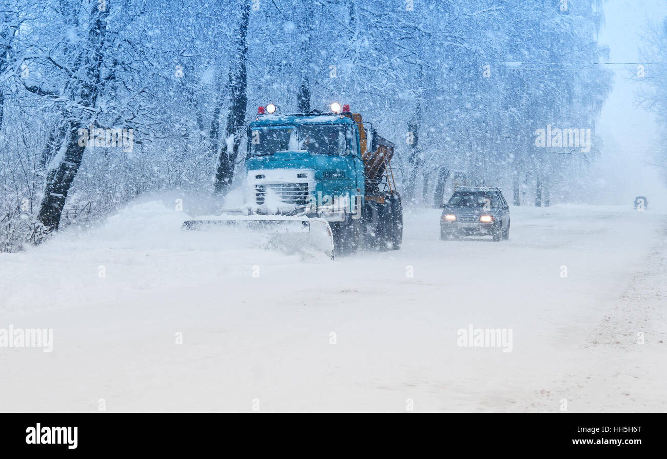 snow plow doing snow removal during blizzard Stock Photo - Alamy