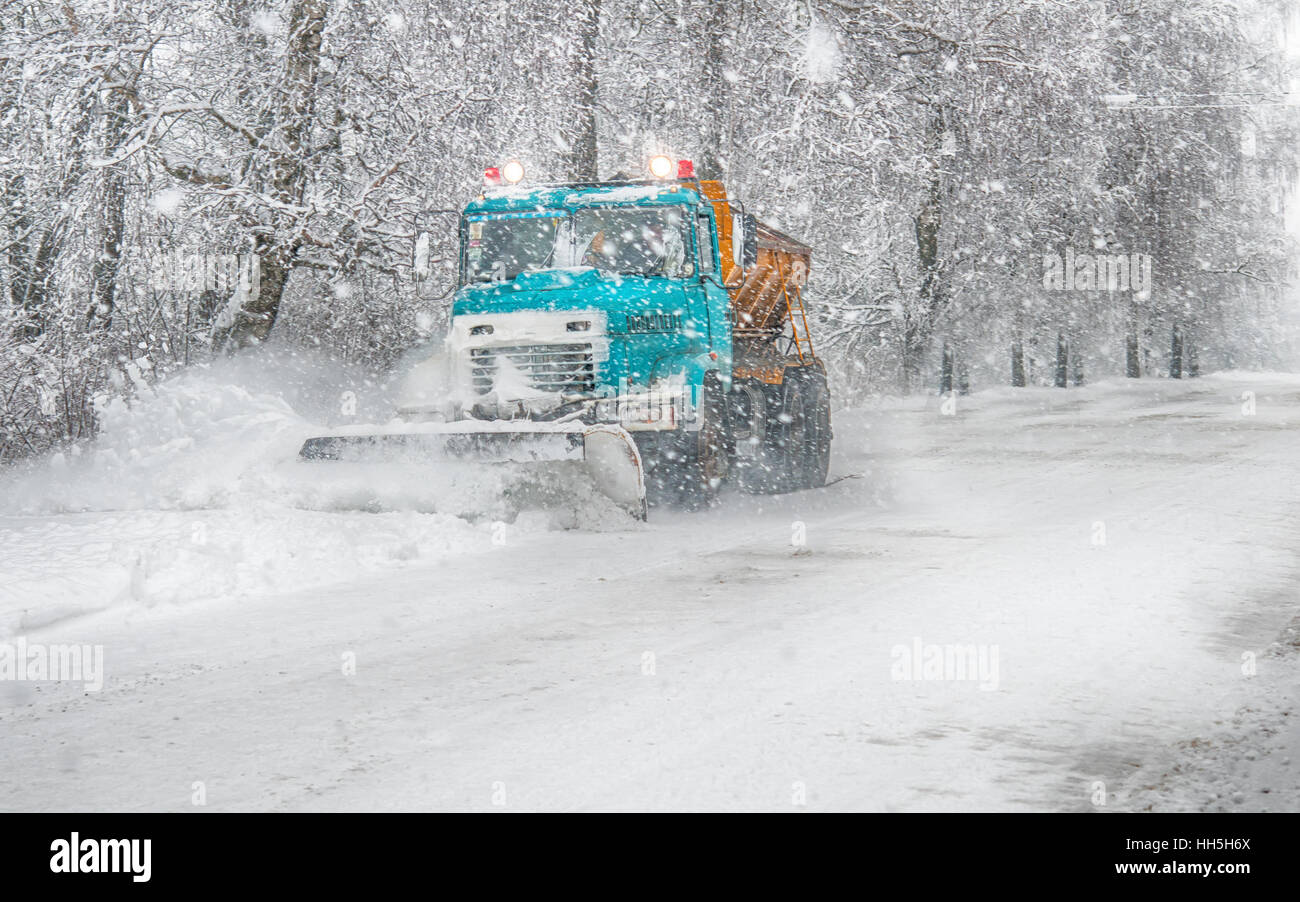 snow plow doing snow removal during blizzard Stock Photo - Alamy