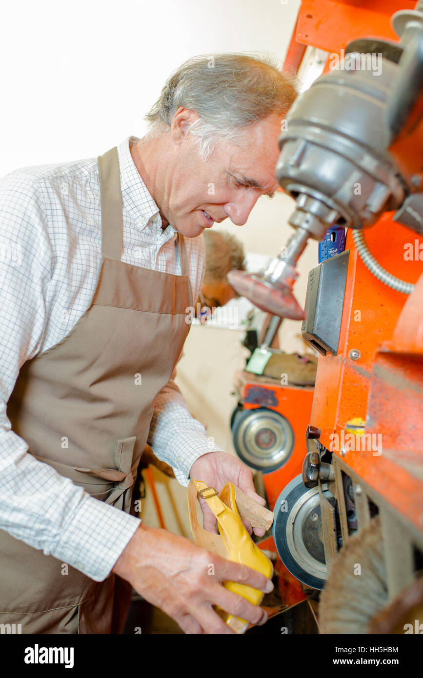 Shoemaker at work Stock Photo - Alamy