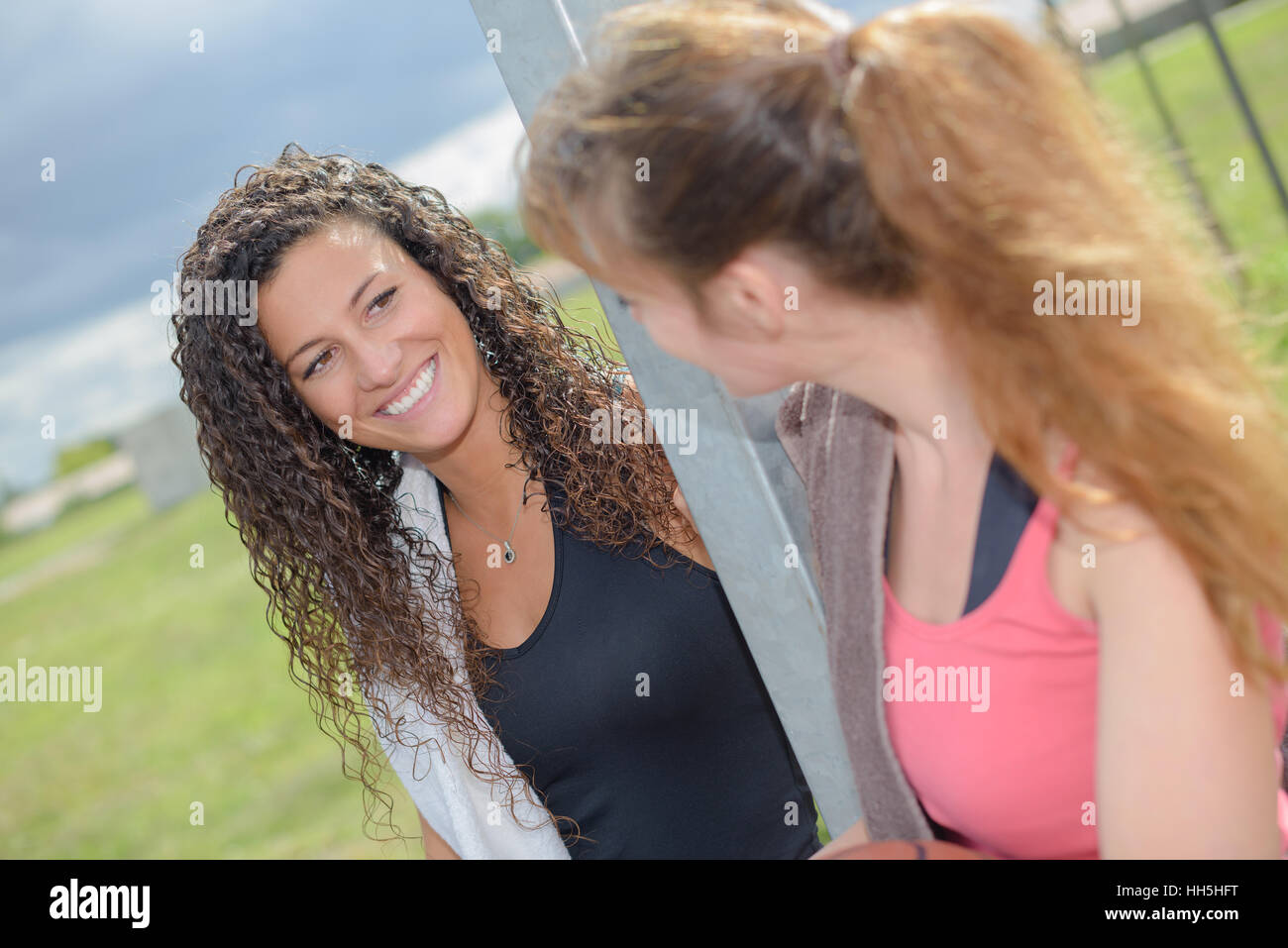 two friends talking Stock Photo - Alamy