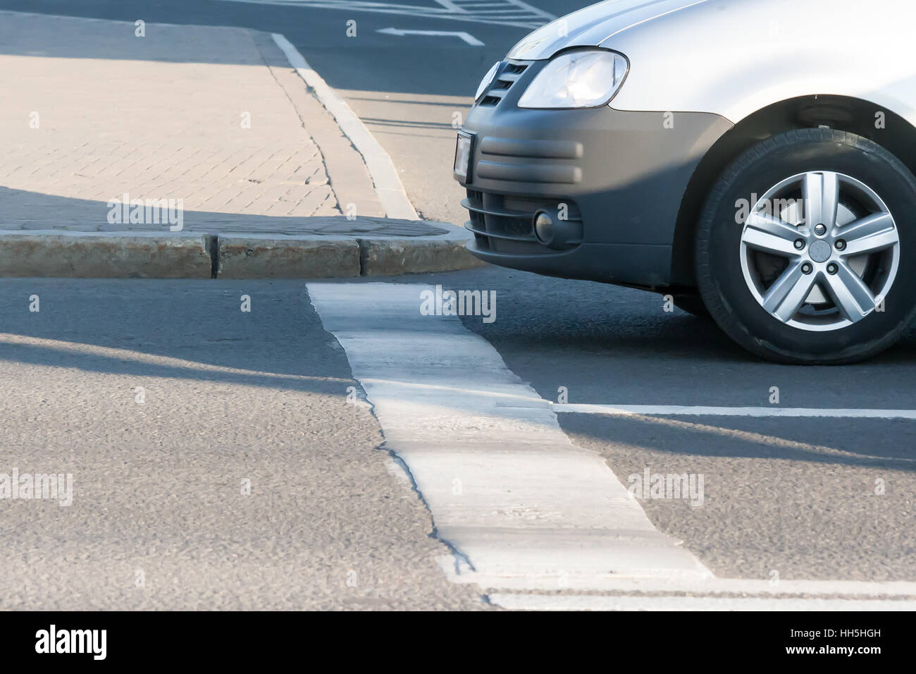 the car which has stopped forward wheels before the stop line in summer ...