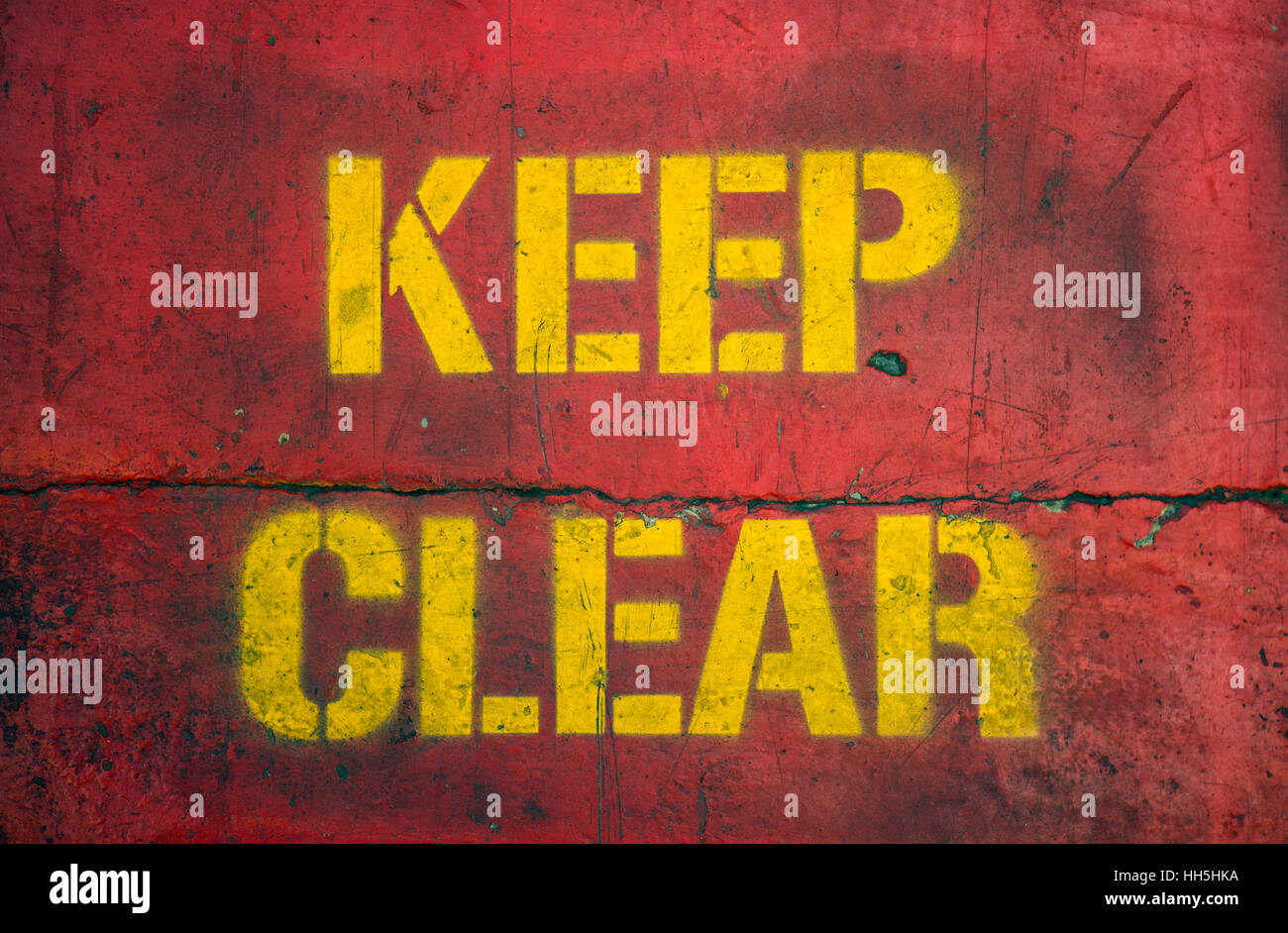 Worn and grungy Keep Clear sign stenciled on concrete Stock Photo - Alamy