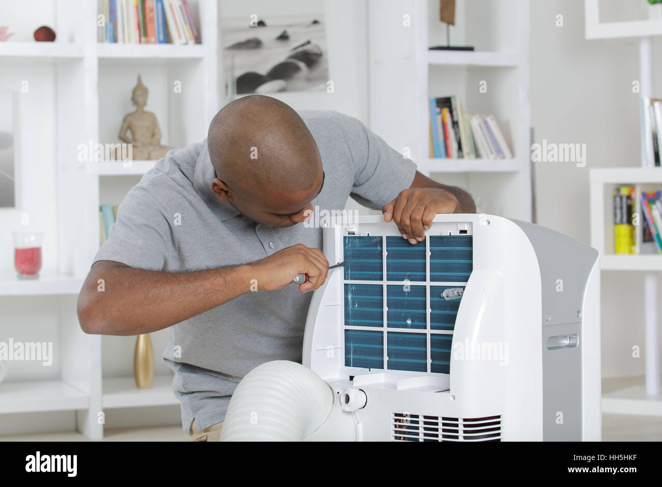 unscrewing an appliance Stock Photo - Alamy