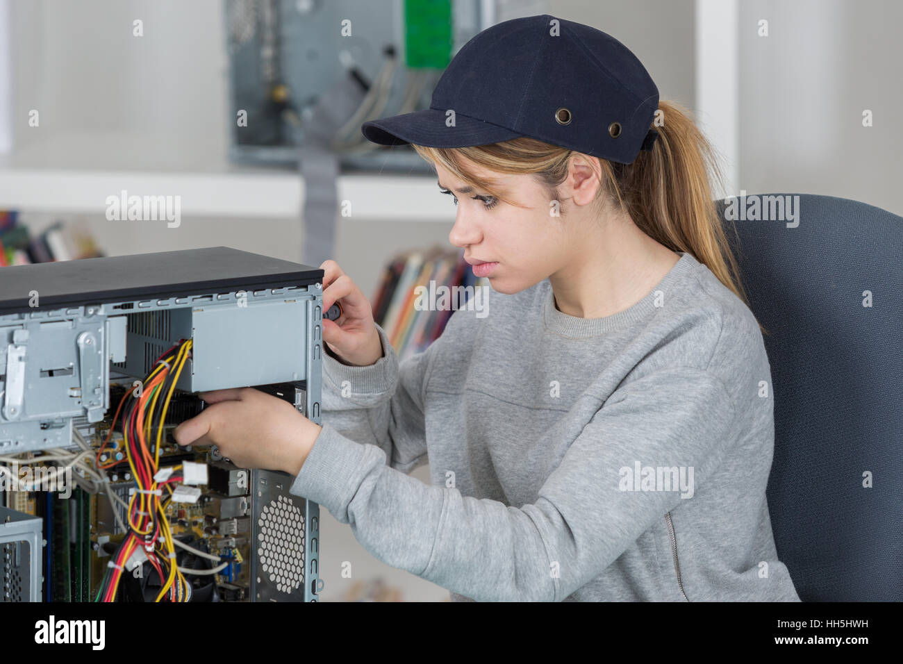 female technician repairing computer Stock Photo - Alamy