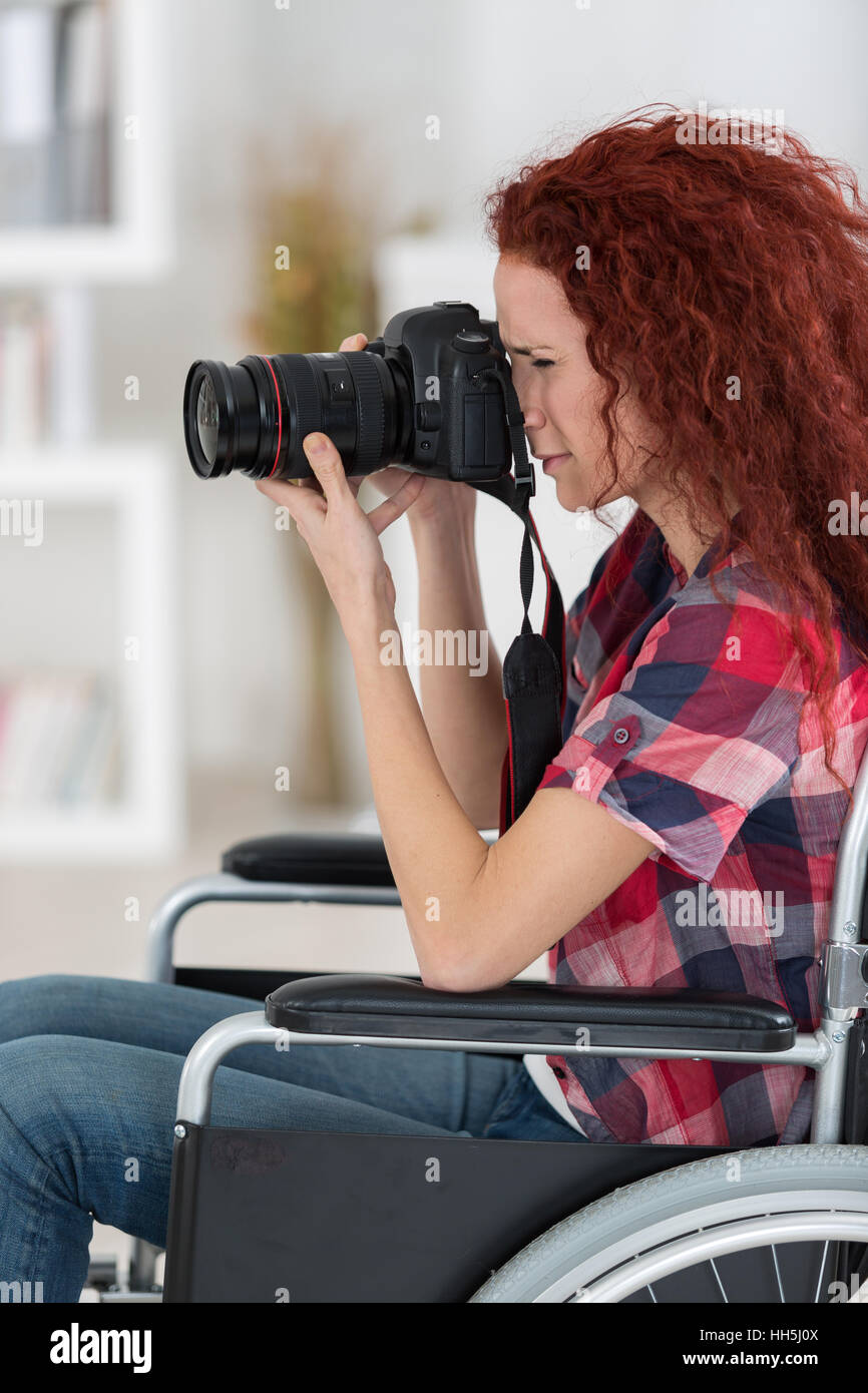 woman on a wheelchair looking in the camera Stock Photo - Alamy
