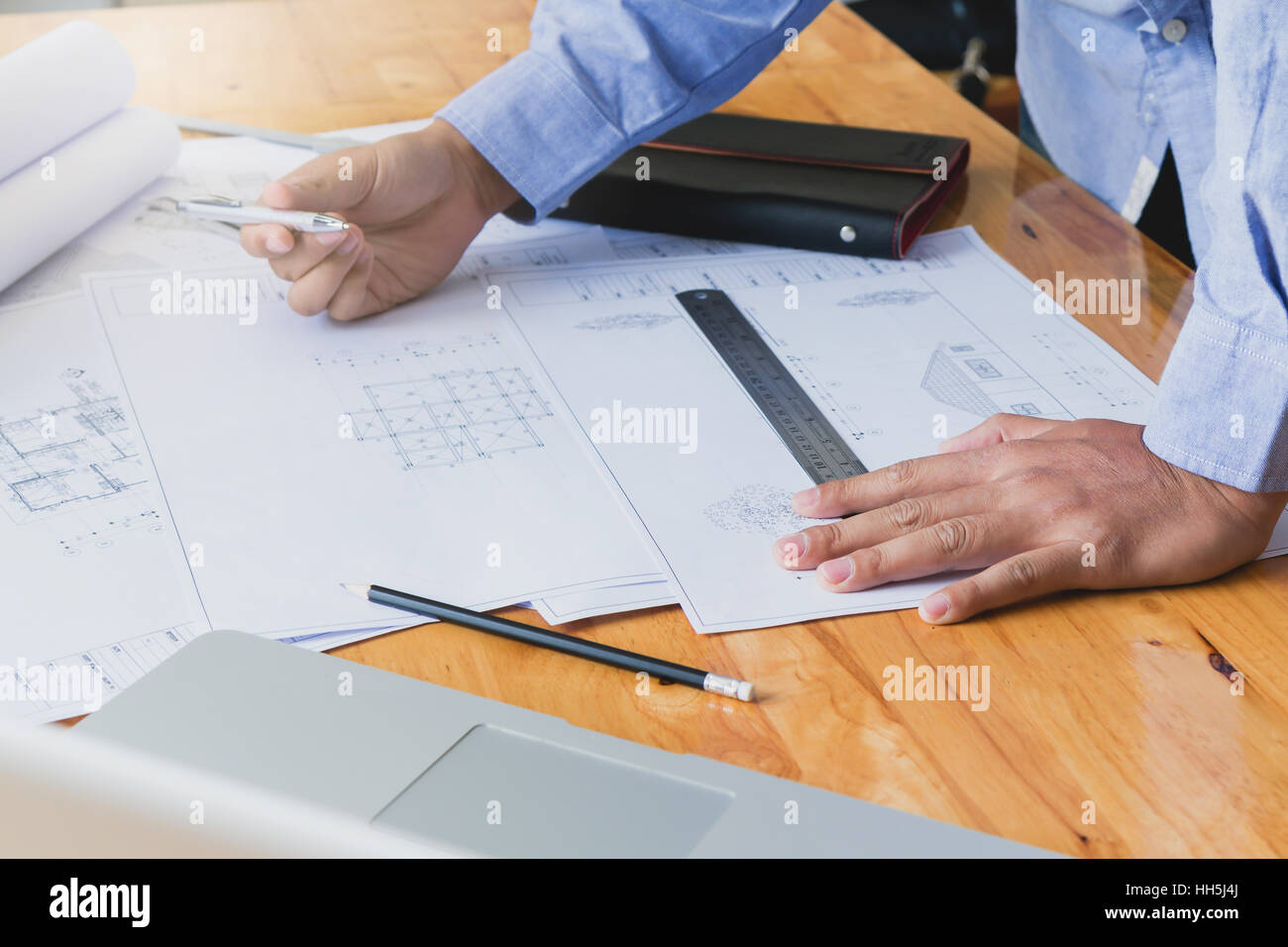 Architect concepts, Architects working with blueprints in the office ...