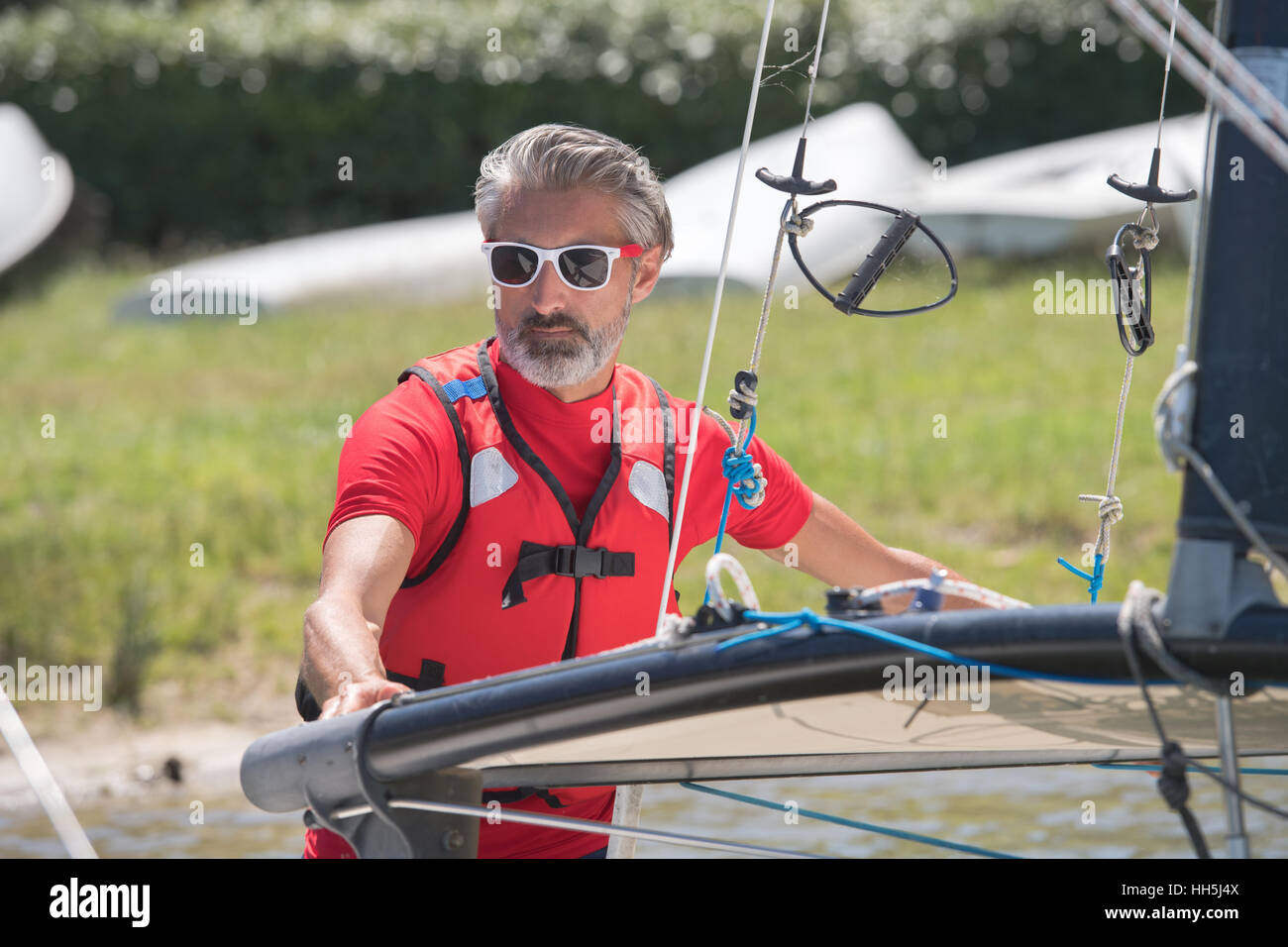 professional waterman training on lake with catamaran Stock Photo - Alamy
