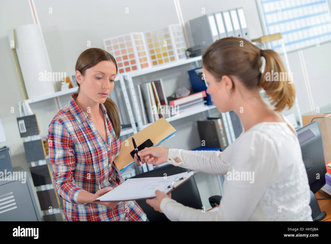 Architect signing off Stock Photo - Alamy
