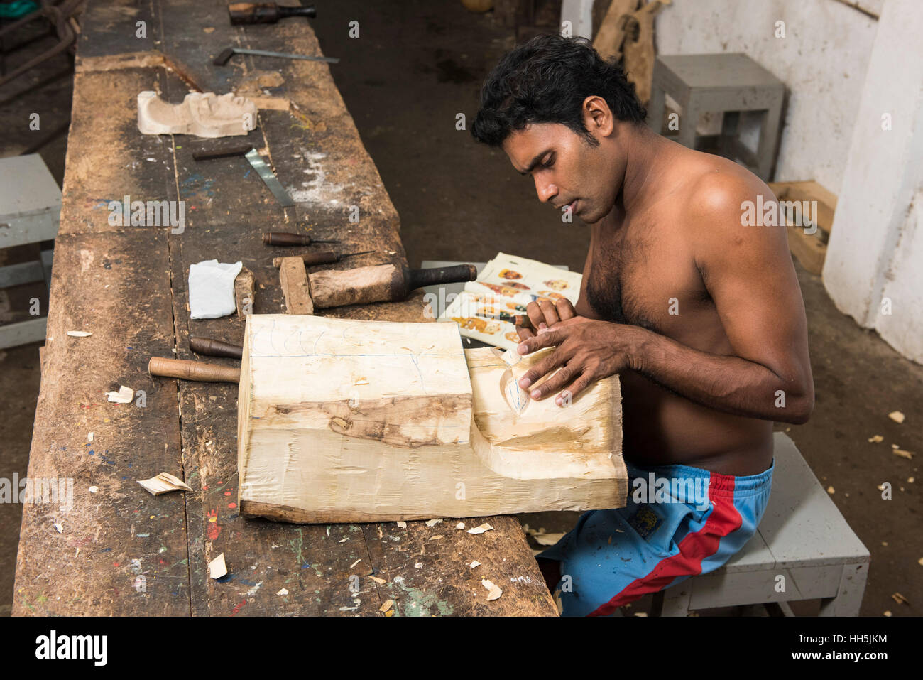 Carpenter making masks in the workshop, Ariyapala and Sons Mask museum ...