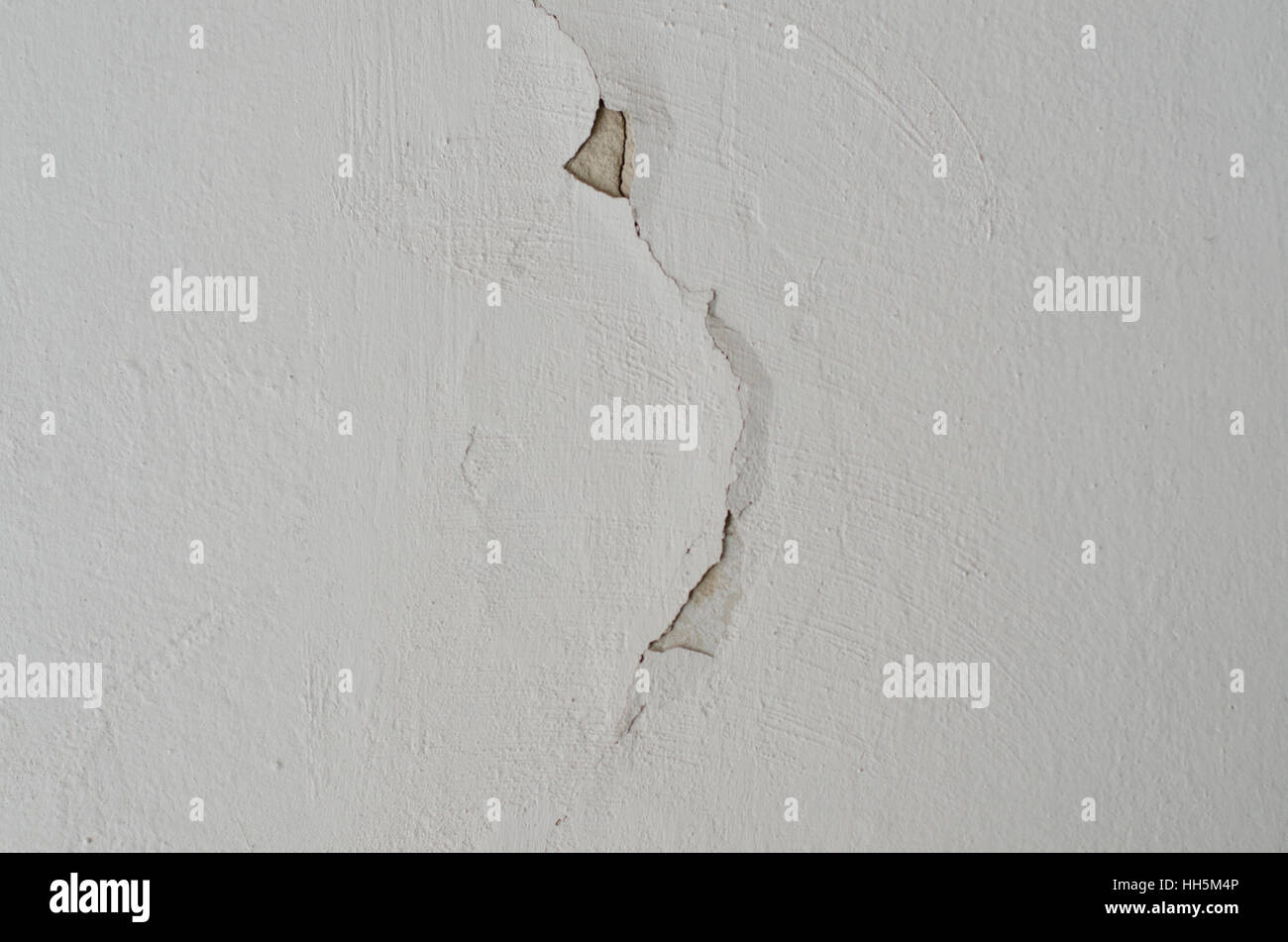 crack on the light wall texture close-up background Stock Photo - Alamy