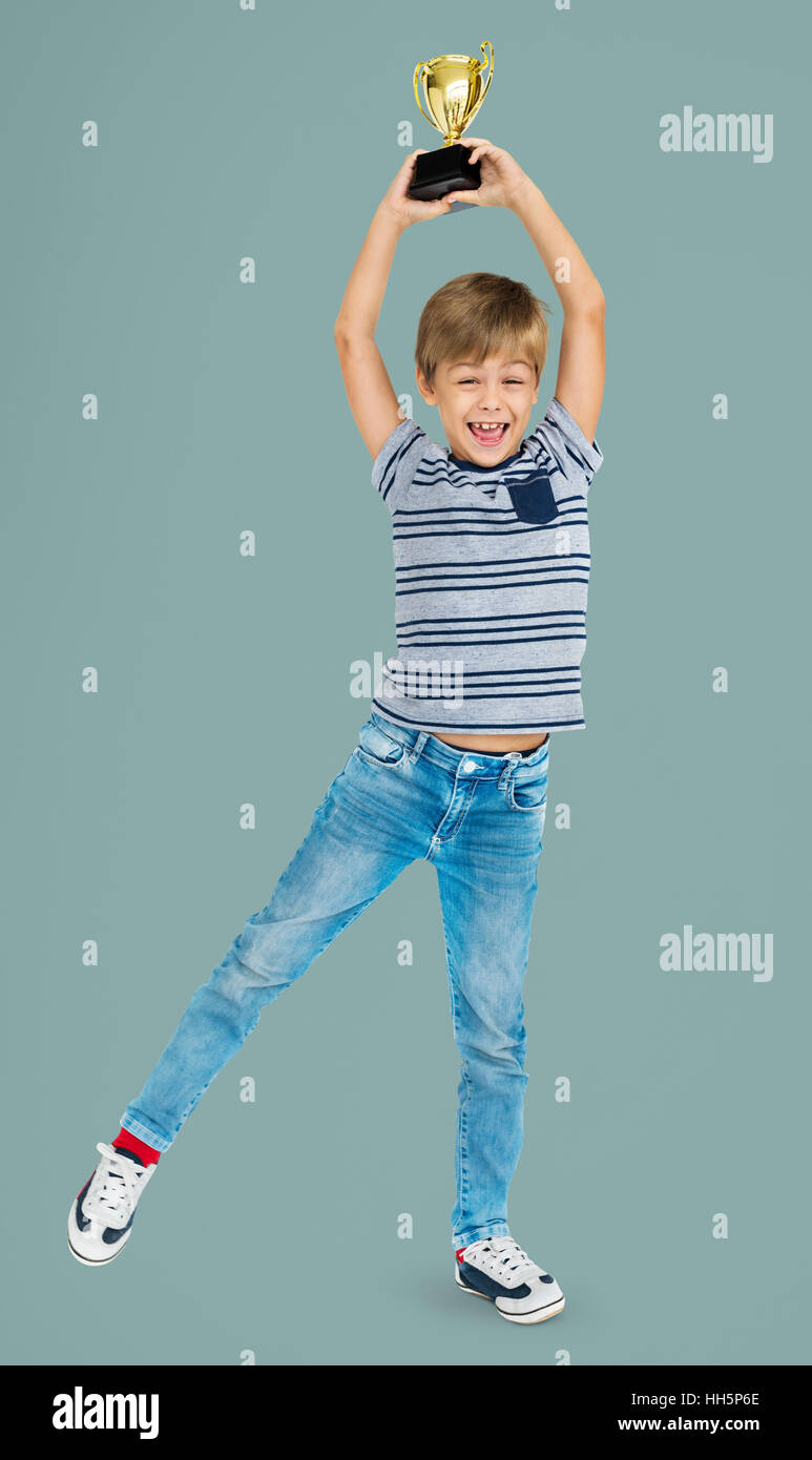 Boy Won Award Reward Cup Prize Concept Stock Photo - Alamy