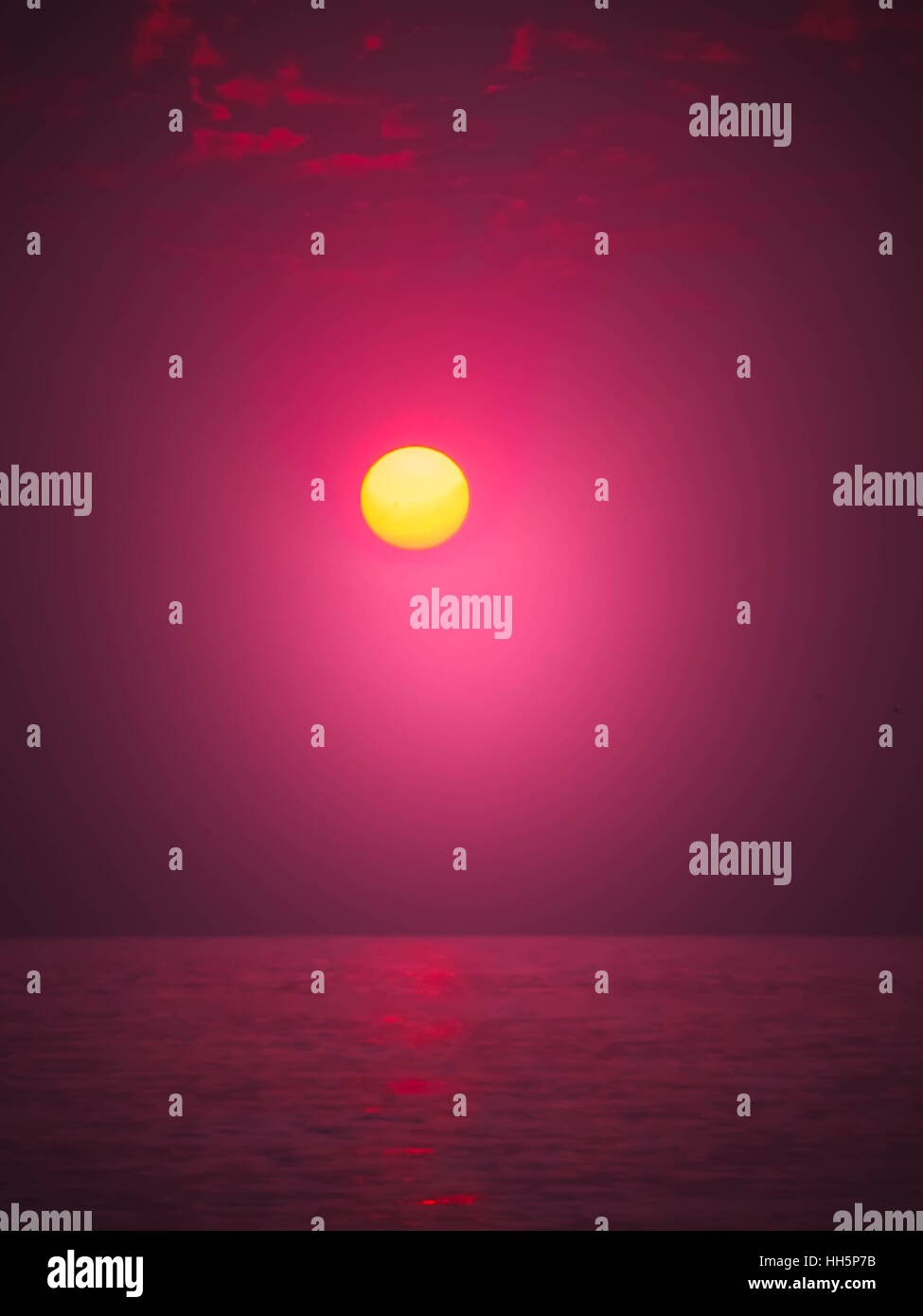 Sun and sea in the pink tones Stock Photo - Alamy
