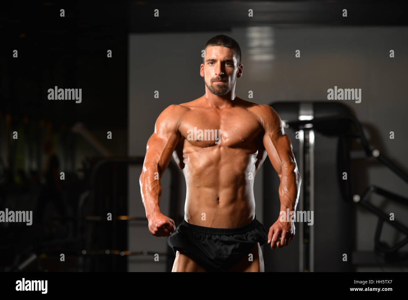 Portrait Of A Young Physically Fit Man Showing His Well Trained Body ...