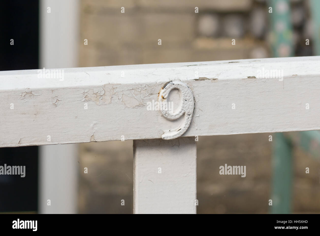 House Number 9 sign on gate painted white Stock Photo - Alamy