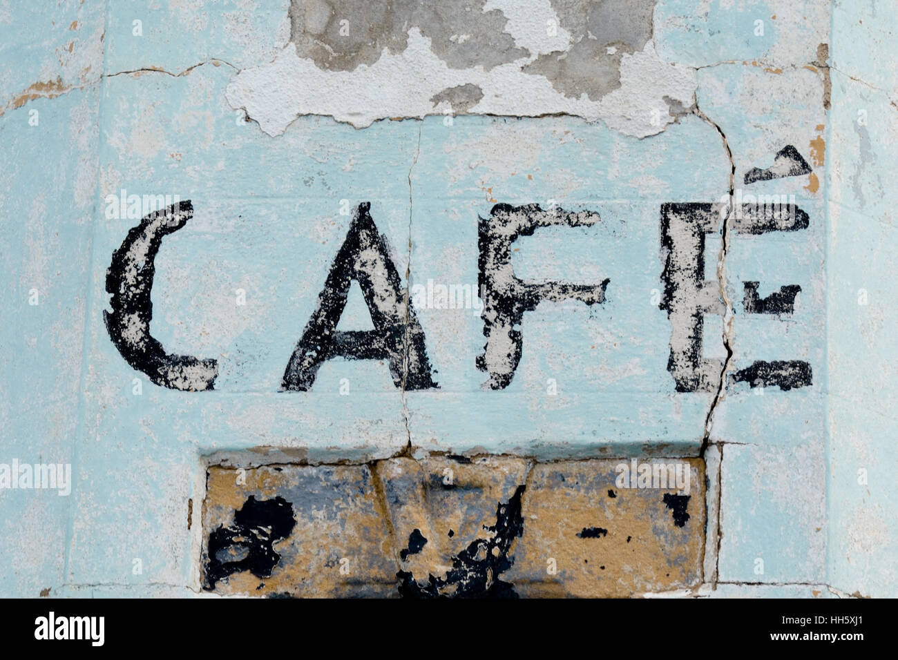 Faded old cafe sign on wall outside establishment Stock Photo - Alamy