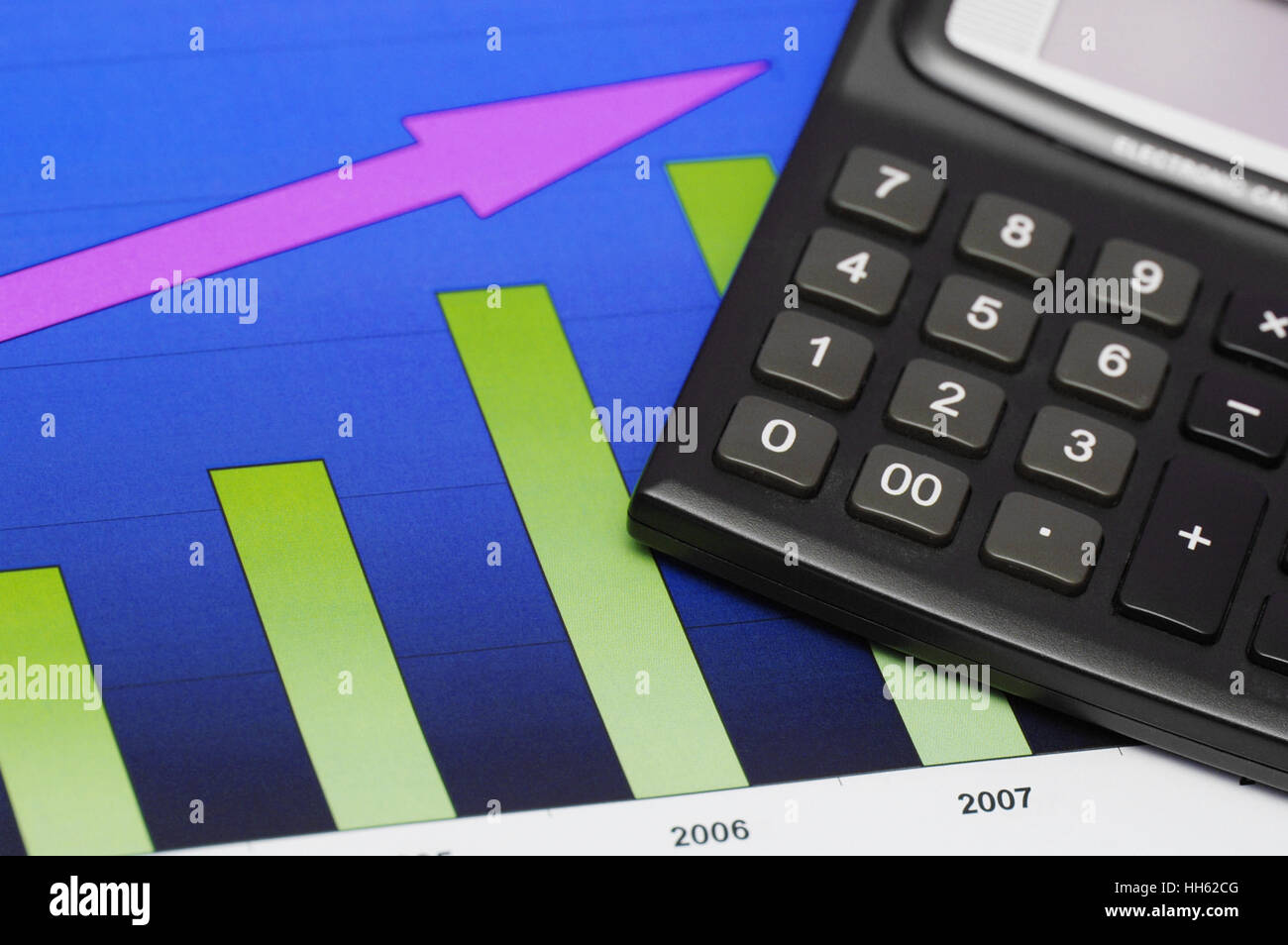 Close up of chart showing growth and calculator Stock Photo - Alamy