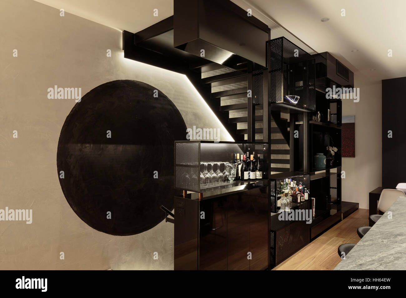 View of "black moon", bar, shelving, island bench and stairs. Black ...