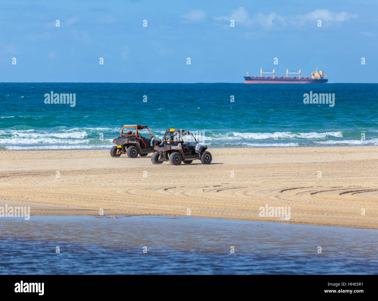 People ride ATV along the sea shore Stock Photo - Alamy