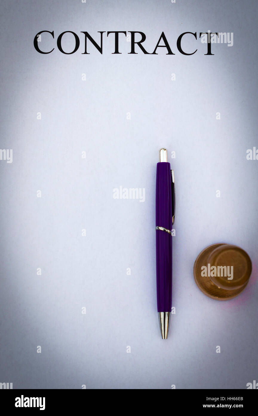 Pen and stamp on a white contract Stock Photo - Alamy