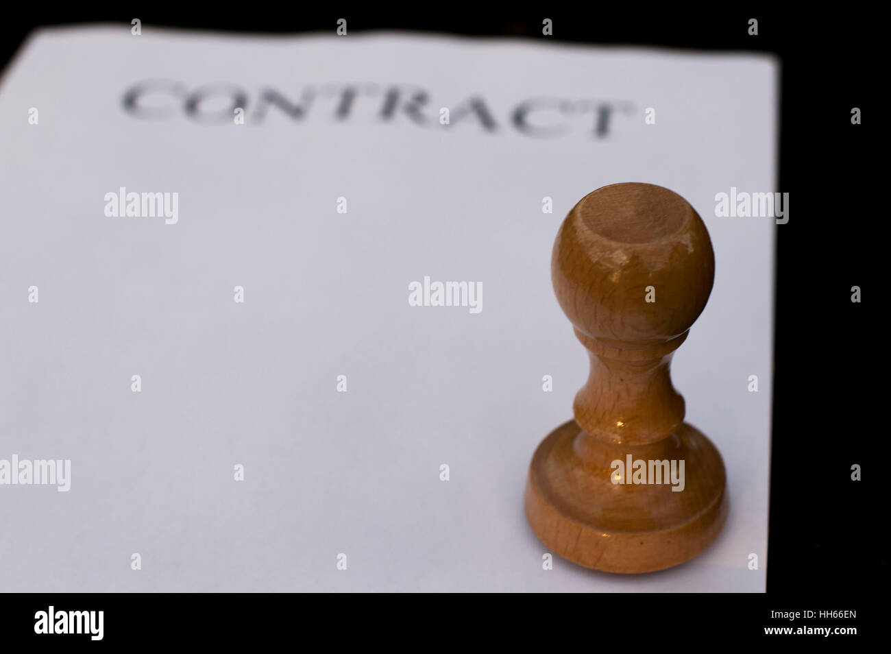 Stamp on a white contract to be filled Stock Photo - Alamy