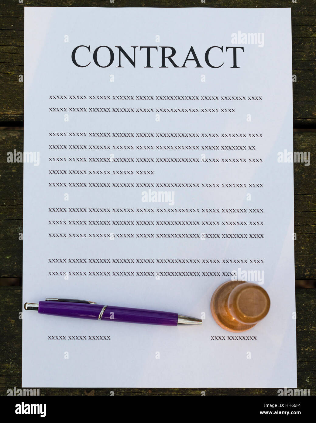 Pen and stamp on a filled contract Stock Photo - Alamy