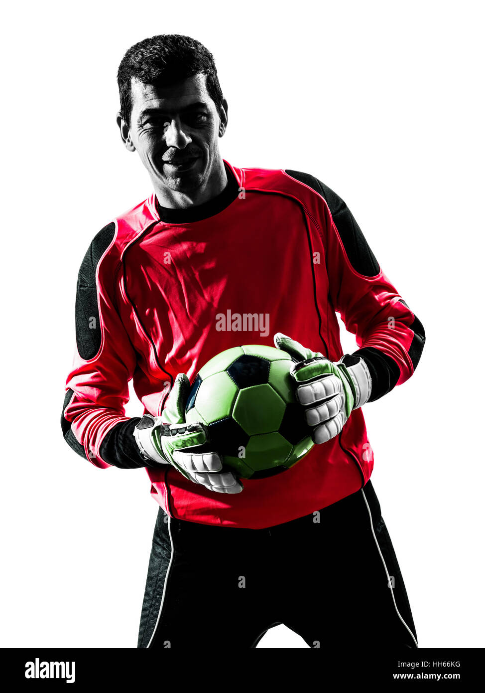 one soccer player goalkeeper man standing holding ball in silhouette ...