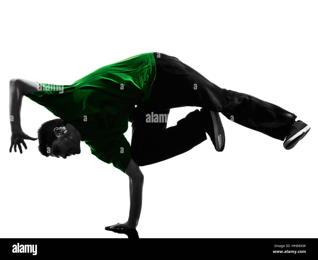 one young acrobatic break dancer breakdancing man in silhouette white ...