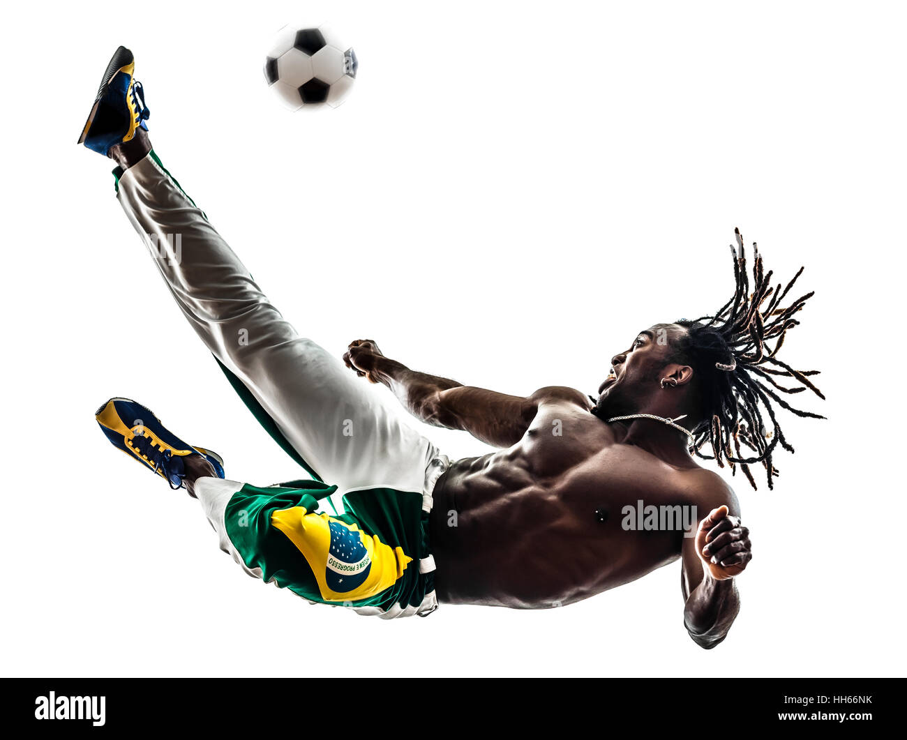 one Brazilian black man soccer player kicking football on white ...