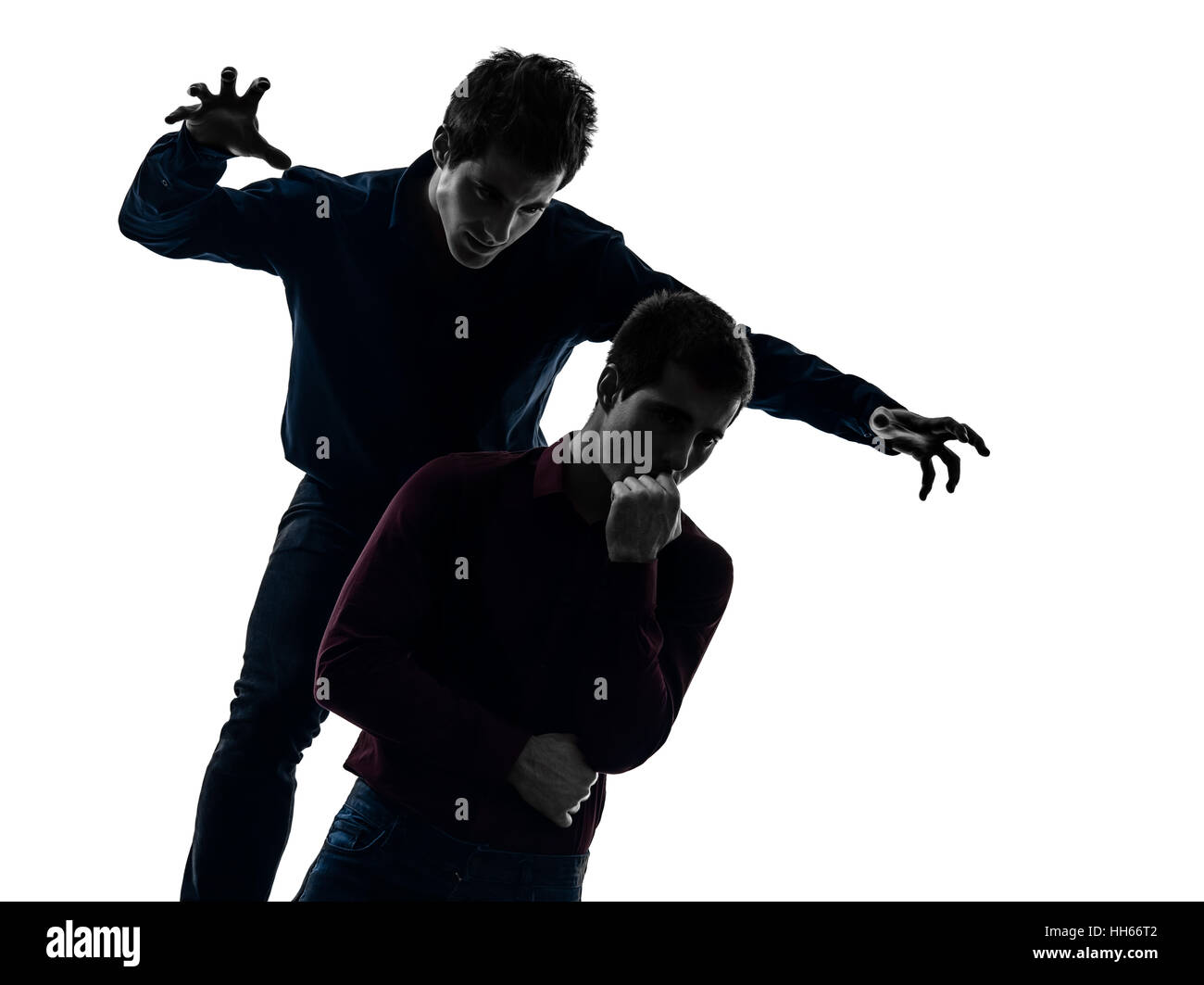 two young men domination concept shadow white background Stock Photo ...