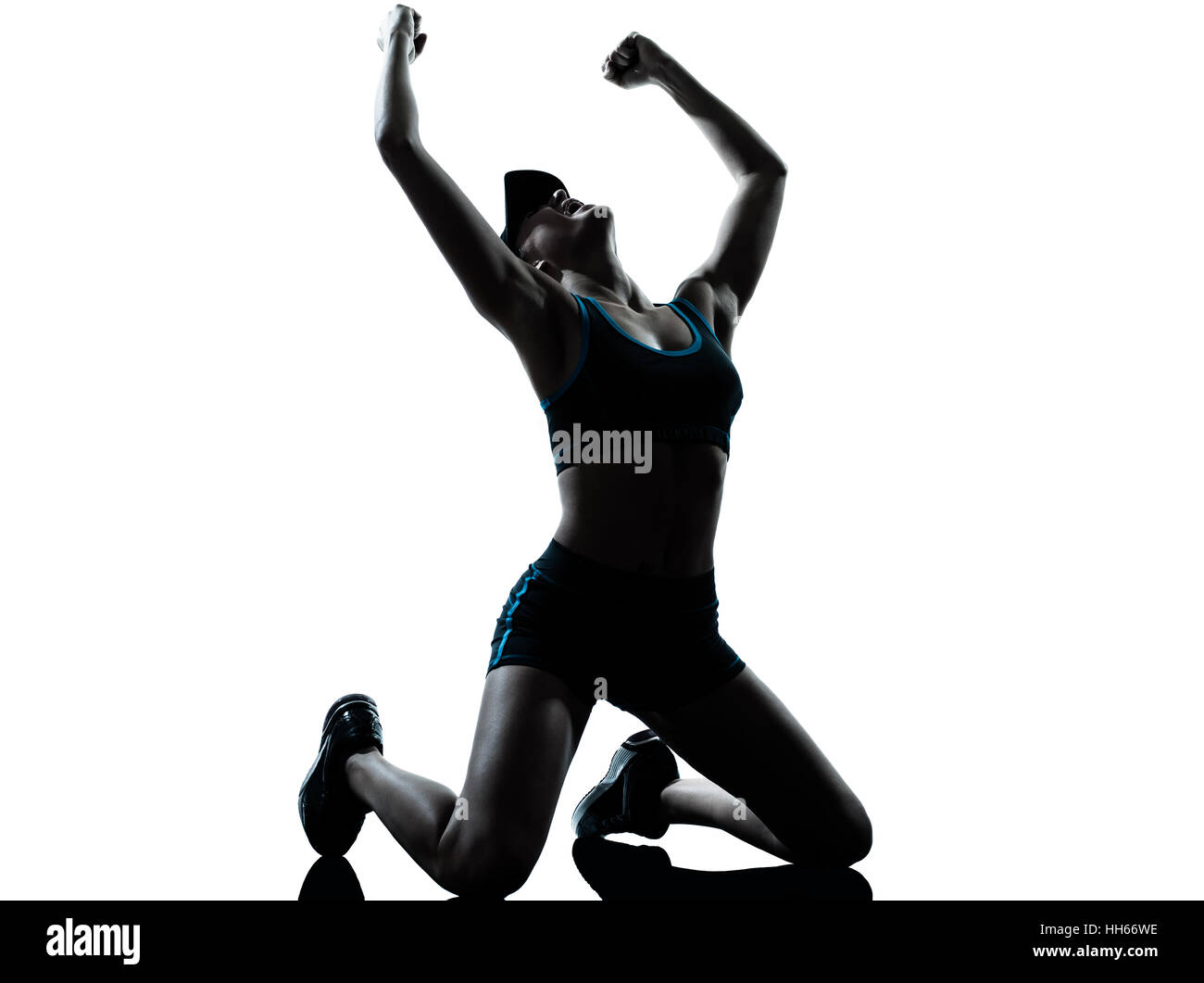 one caucasian woman runner jogger winner victory in silhouette studio ...