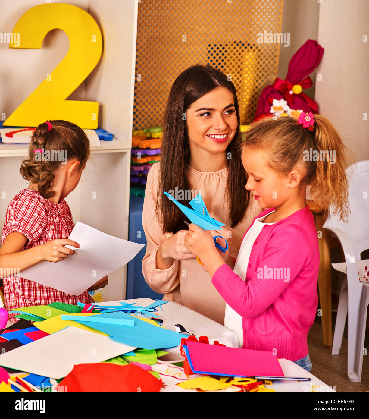 Child cutting paper in class. Development social origami lerning school ...