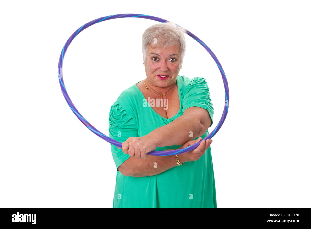 Senior lady doing gymnastic with hula-hoop - isolated on white ...