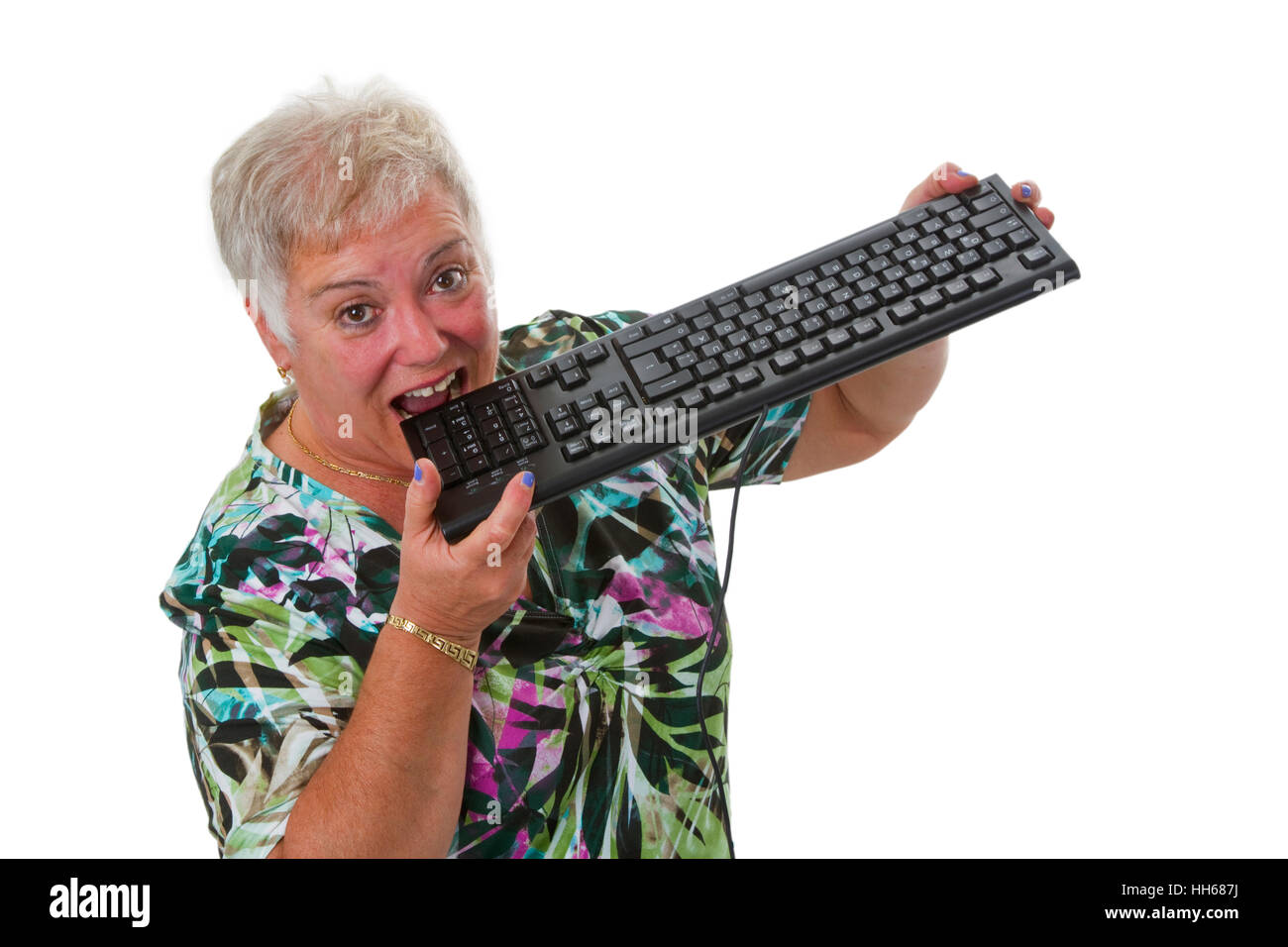 Female senior with keyboard - isolated on white background Stock Photo ...