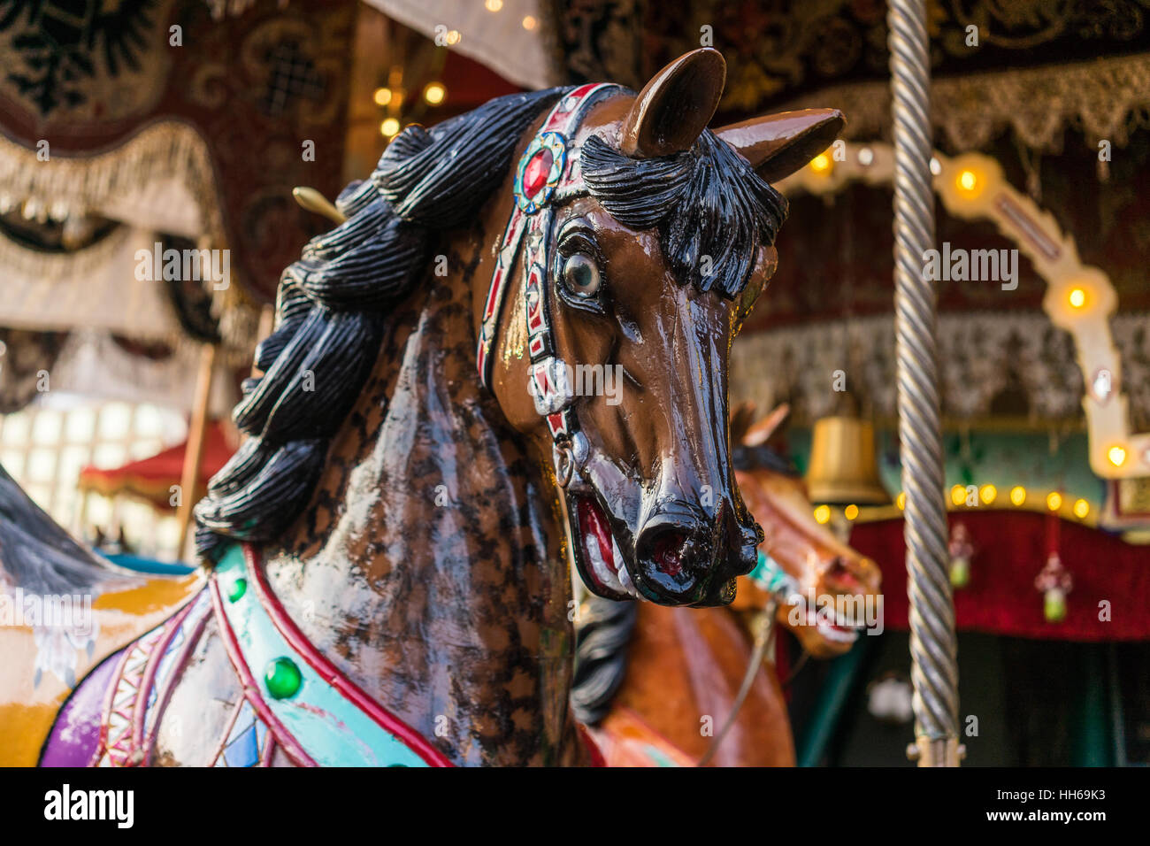 Carousel at a carnival or festival. Decorative ornate horse at a fun ...