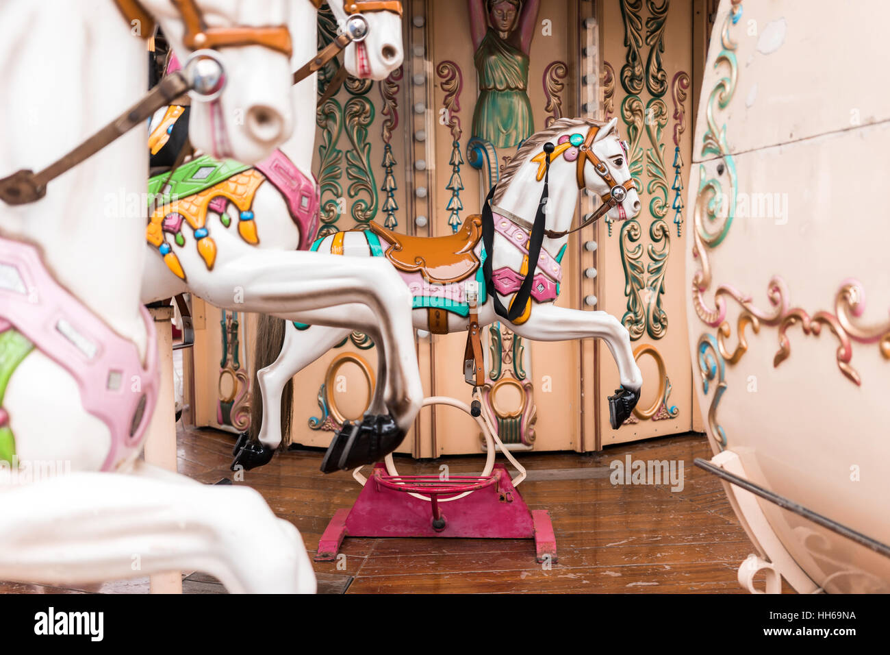 Carousel at a carnival or festival. Decorative ornate horse at a fun ...