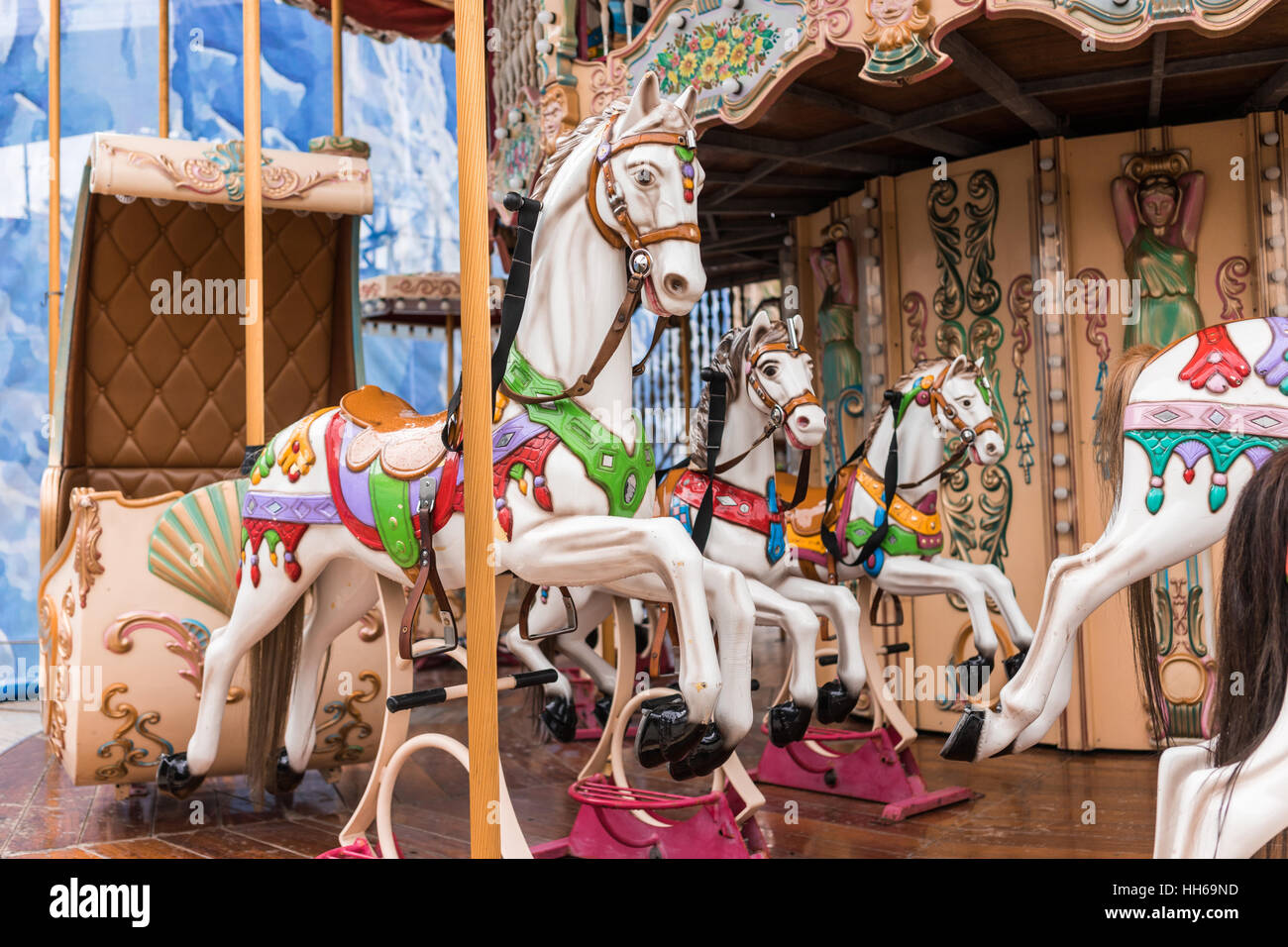 Carousel at a carnival or festival. Decorative ornate horse at a fun ...