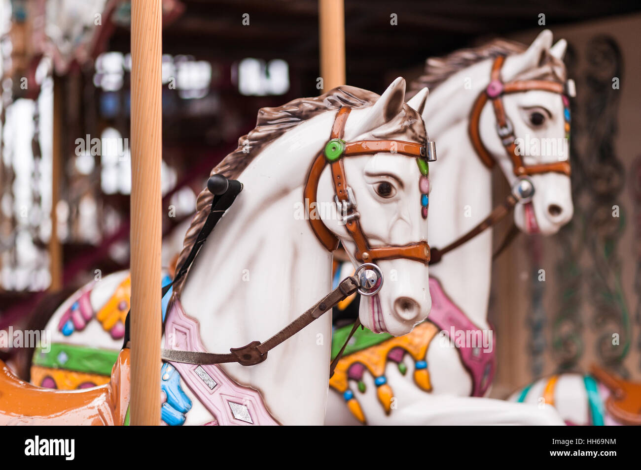 Carousel at a carnival or festival. Decorative ornate horse at a fun ...