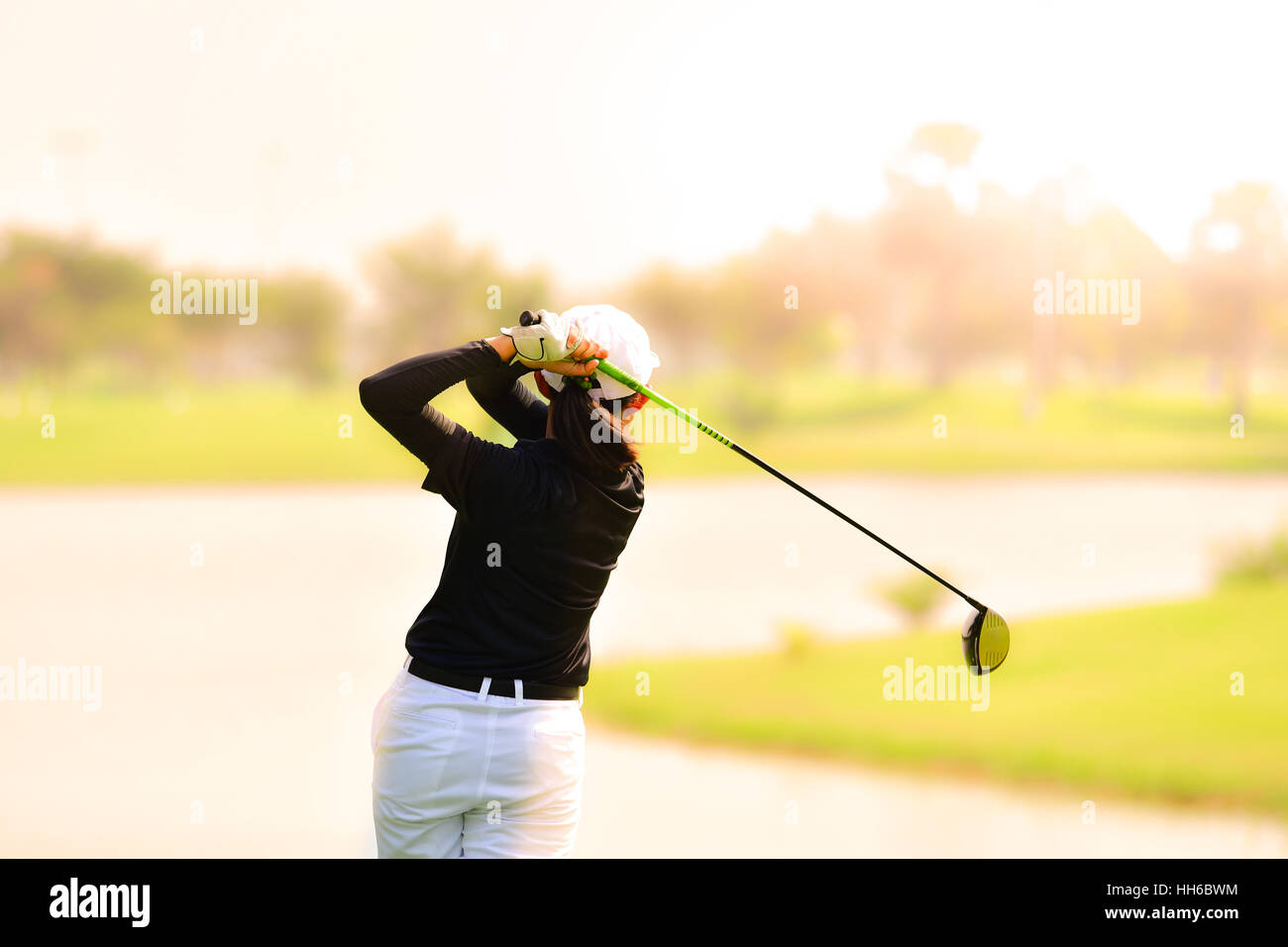 Golfer hitting golf shot on summer vacation, concept go to success ...