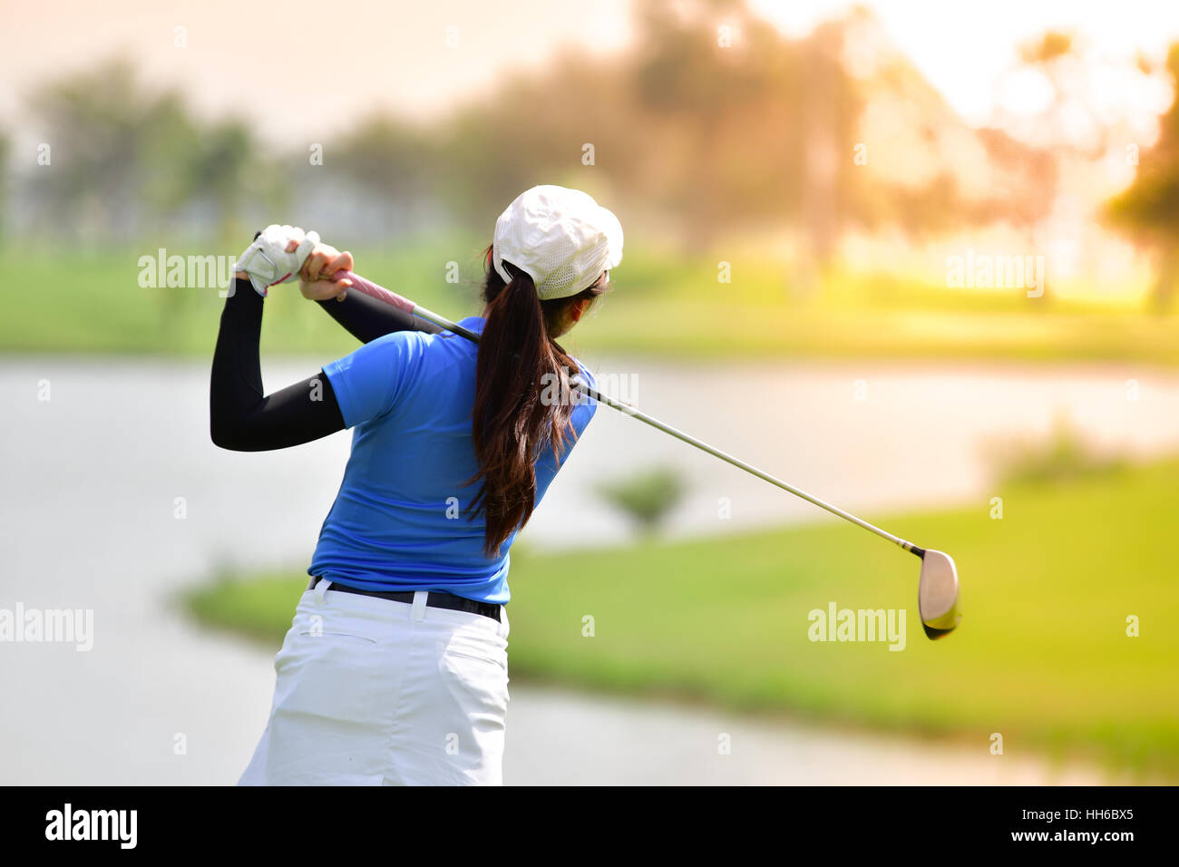 Golfer hitting golf shot on summer vacation, concept go to success ...