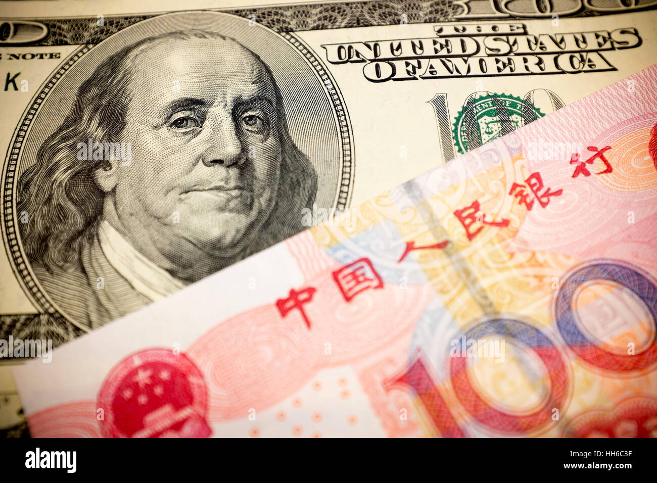 Chinese Yuan Note and U.S. dollar background (Exchange rate concept ...