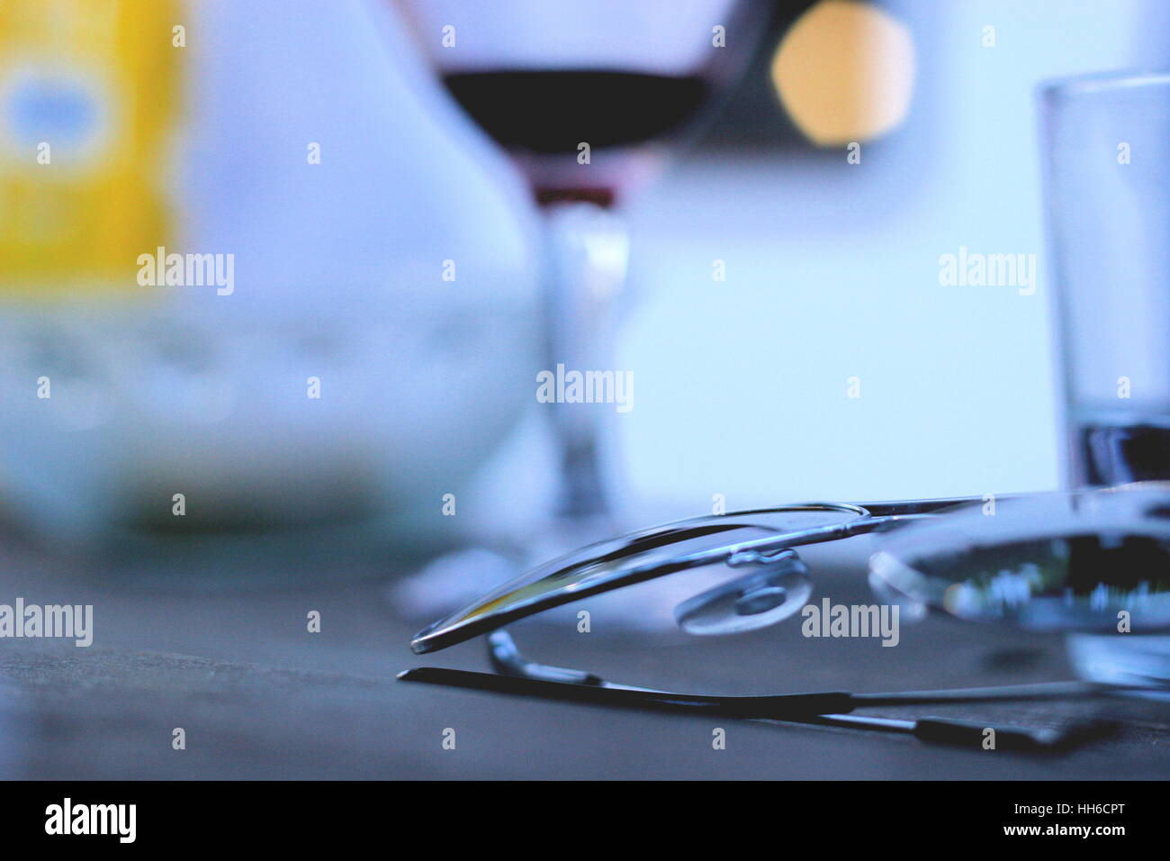 Sunglasses on table Stock Photo - Alamy