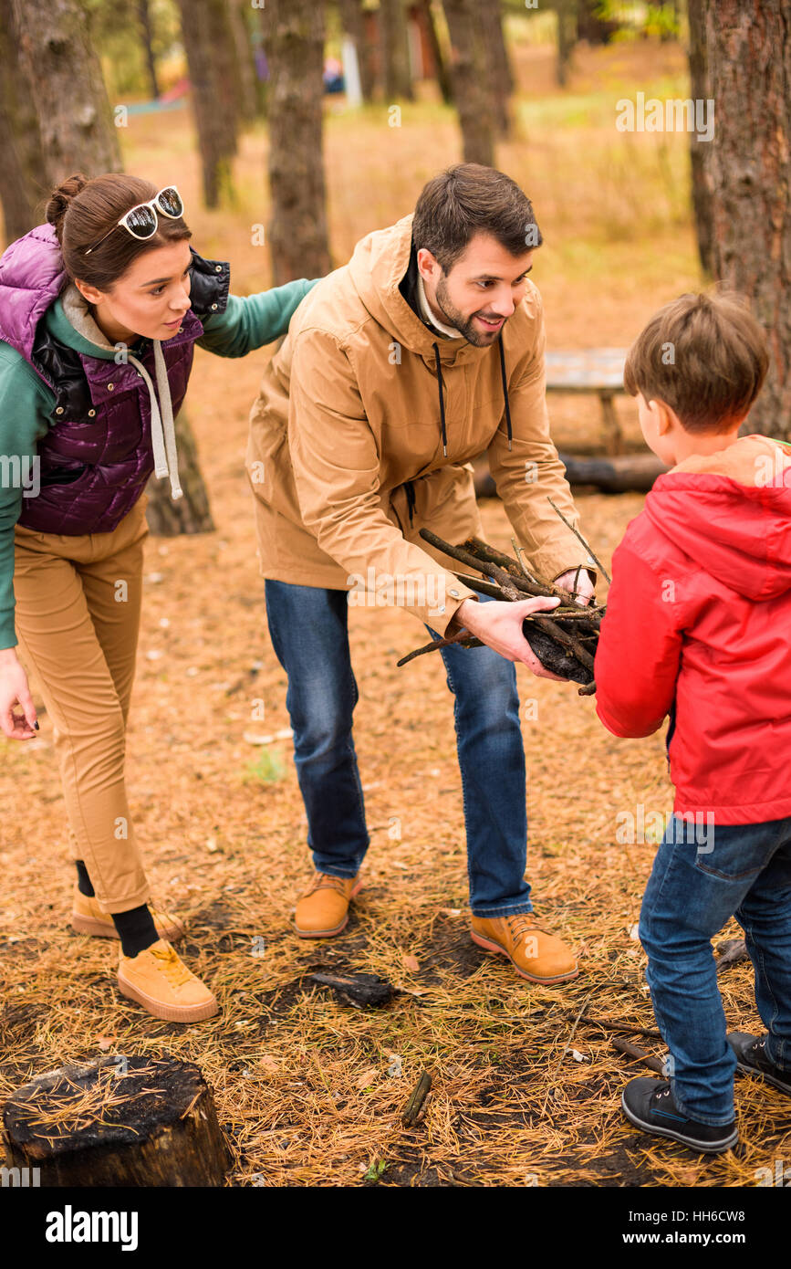 Father and son collecting firewood hi-res stock photography and images ...
