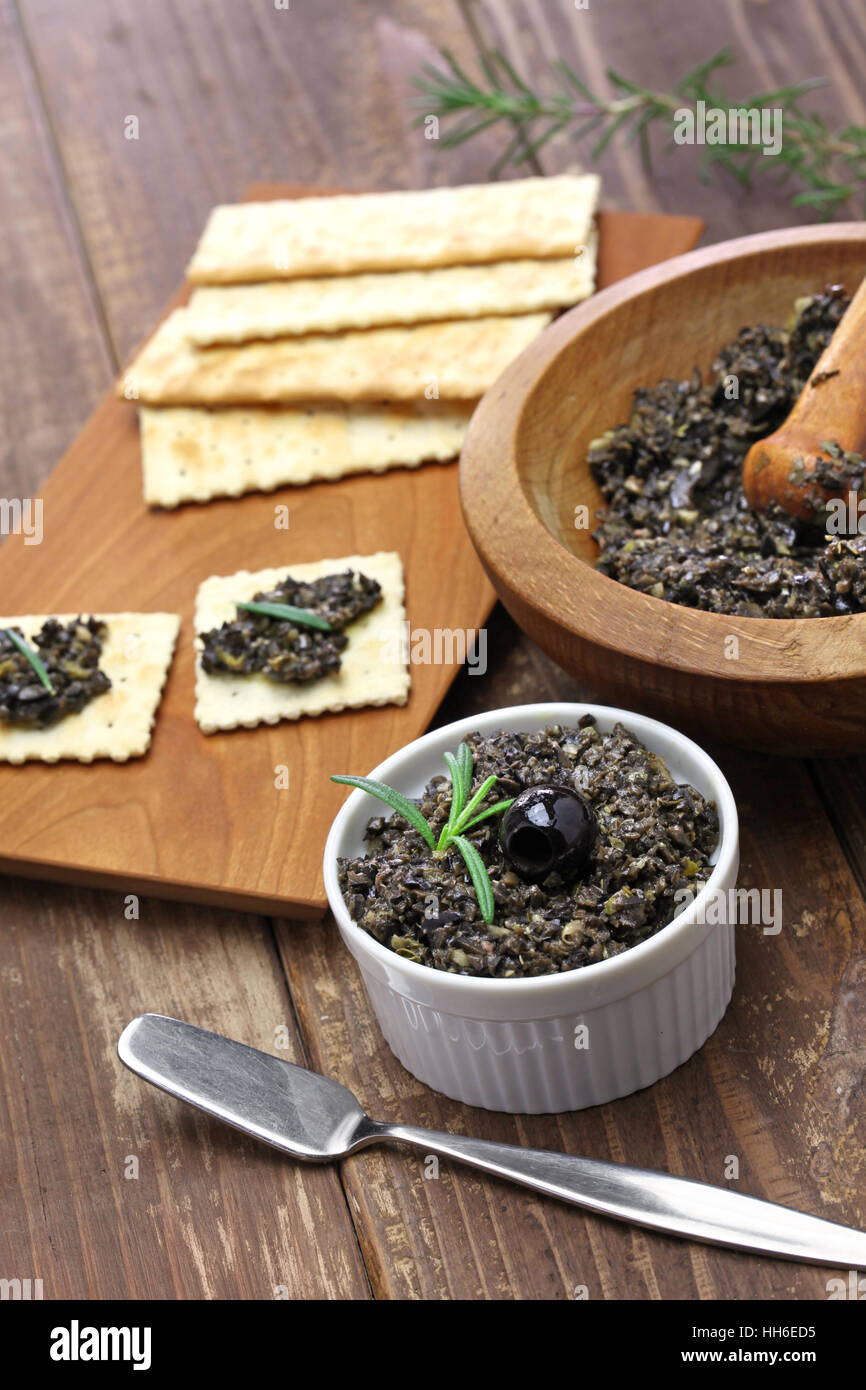 black olive tapenade with crackers Stock Photo - Alamy